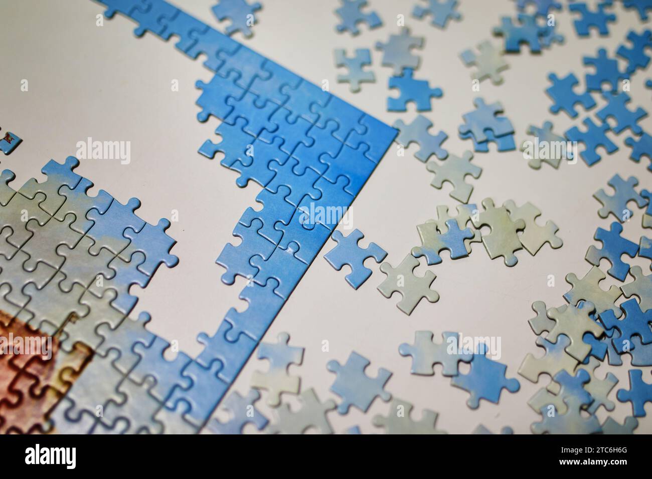 Connecting jigsaw puzzle pieces, fun family activity Stock Photo - Alamy