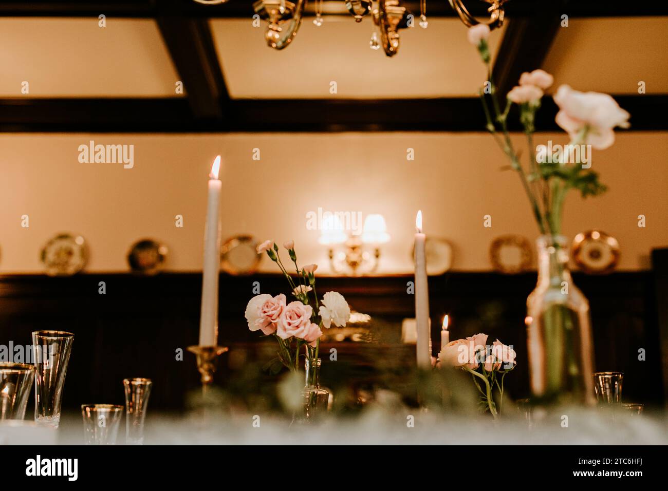 Moody romantic dinner in gold candle light Stock Photo - Alamy