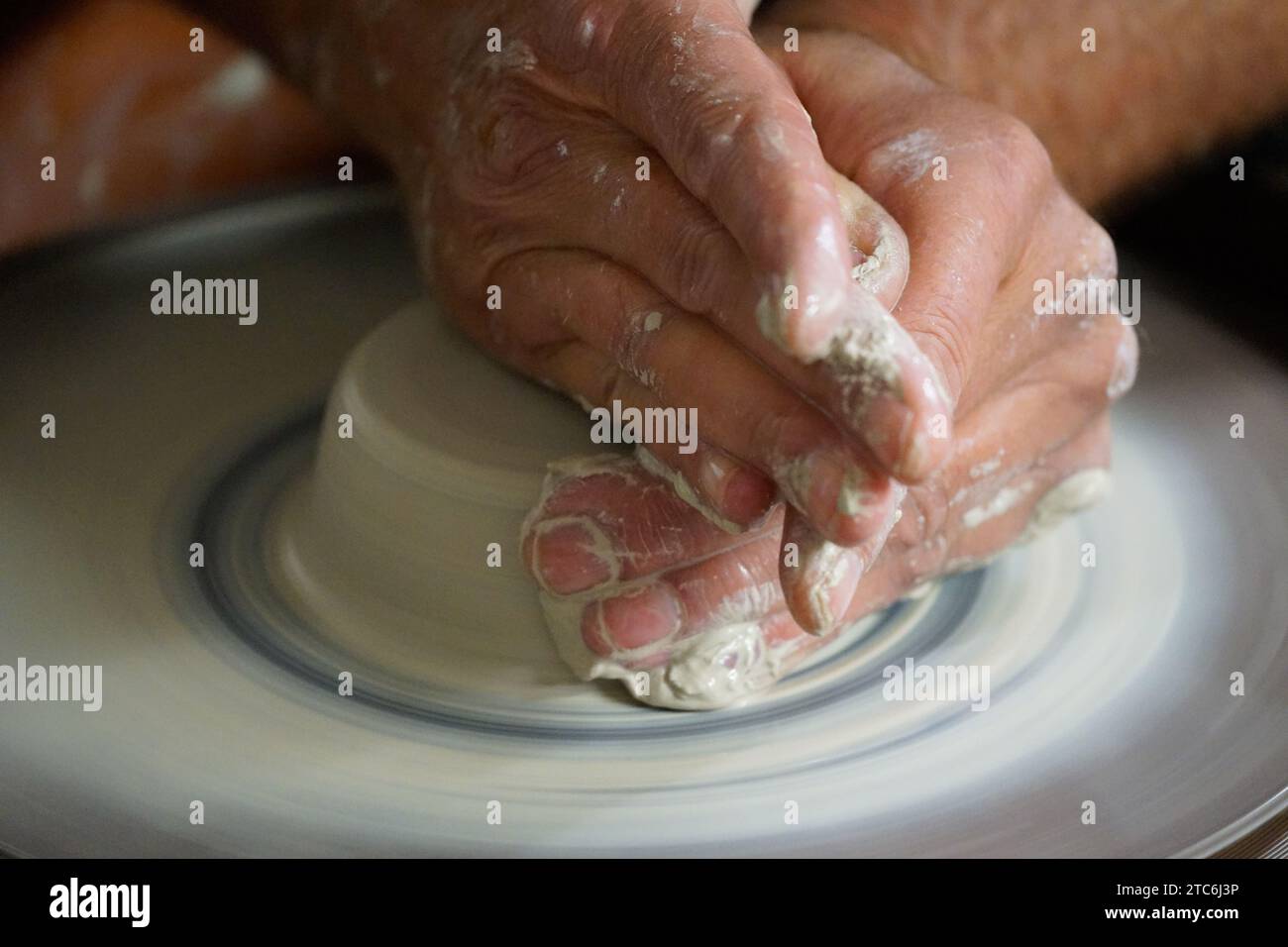 Close up throwing hands on a wheel Stock Photo - Alamy