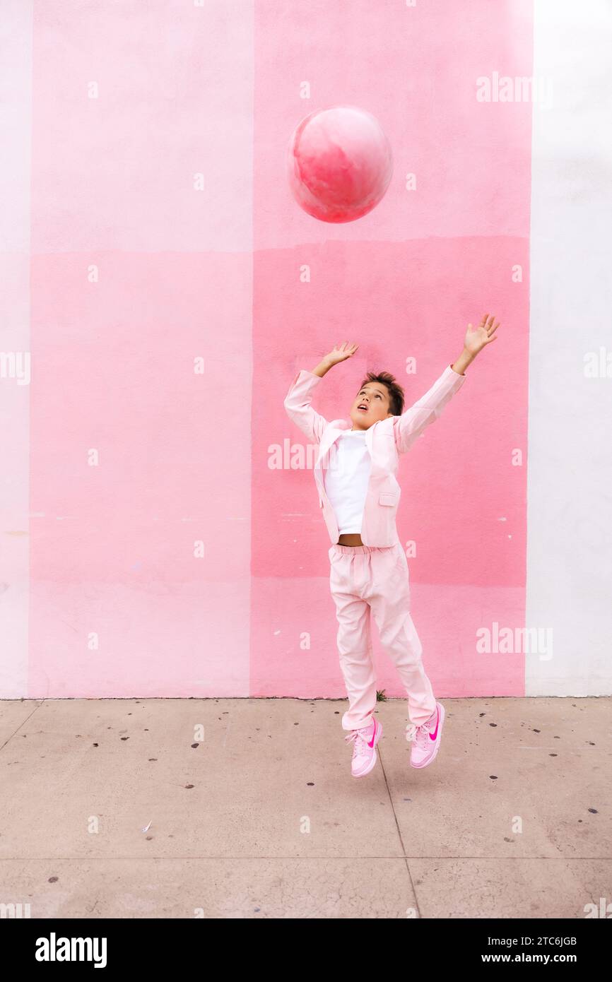 Boy bouncing ball hi-res stock photography and images - Alamy