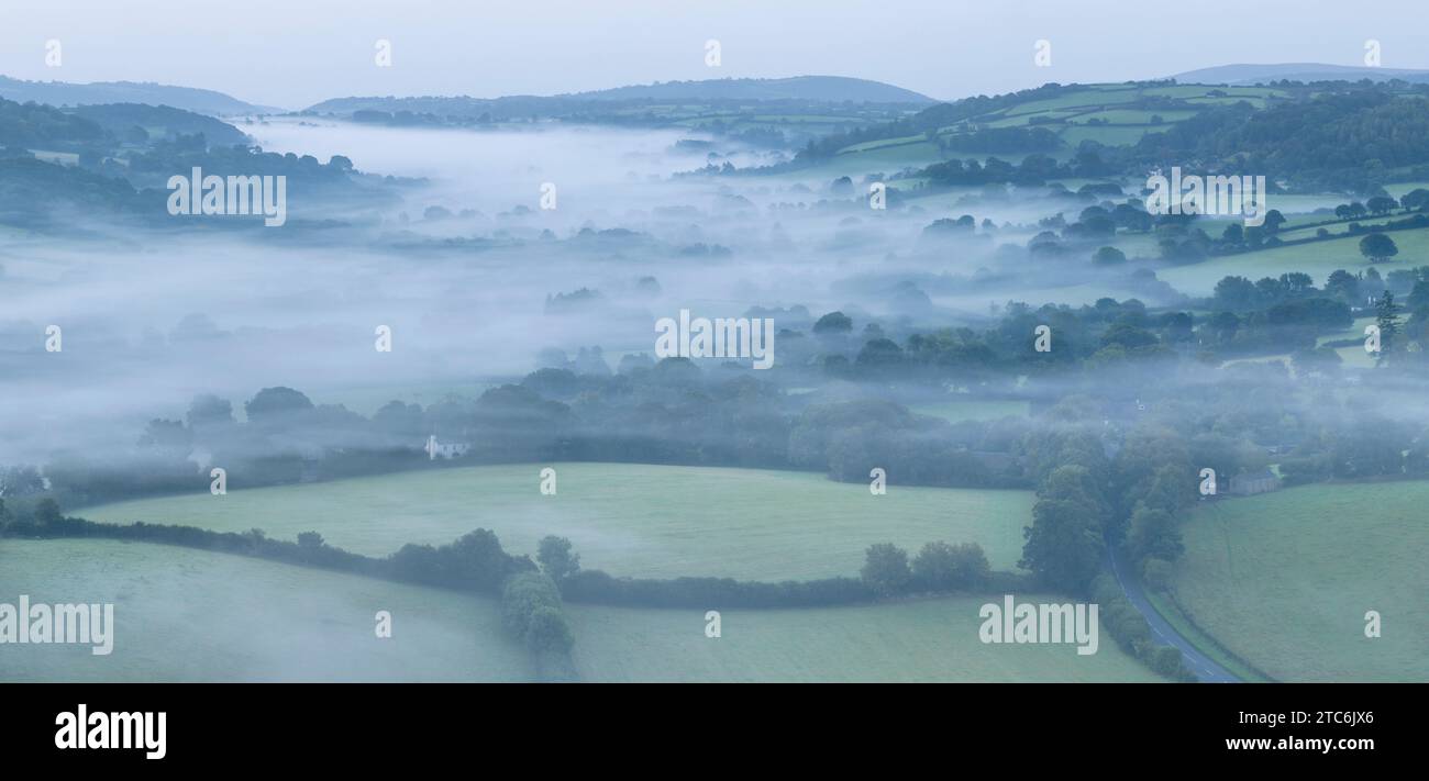 Mist shrouded rolling countryside near Chagford in Dartmoor National ...