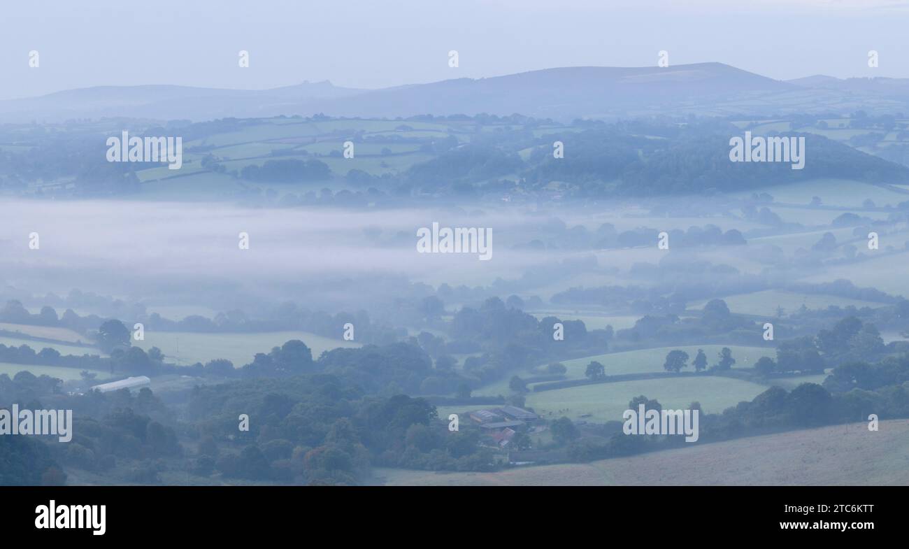 Mist shrouded rolling countryside near Chagford in Dartmoor National ...
