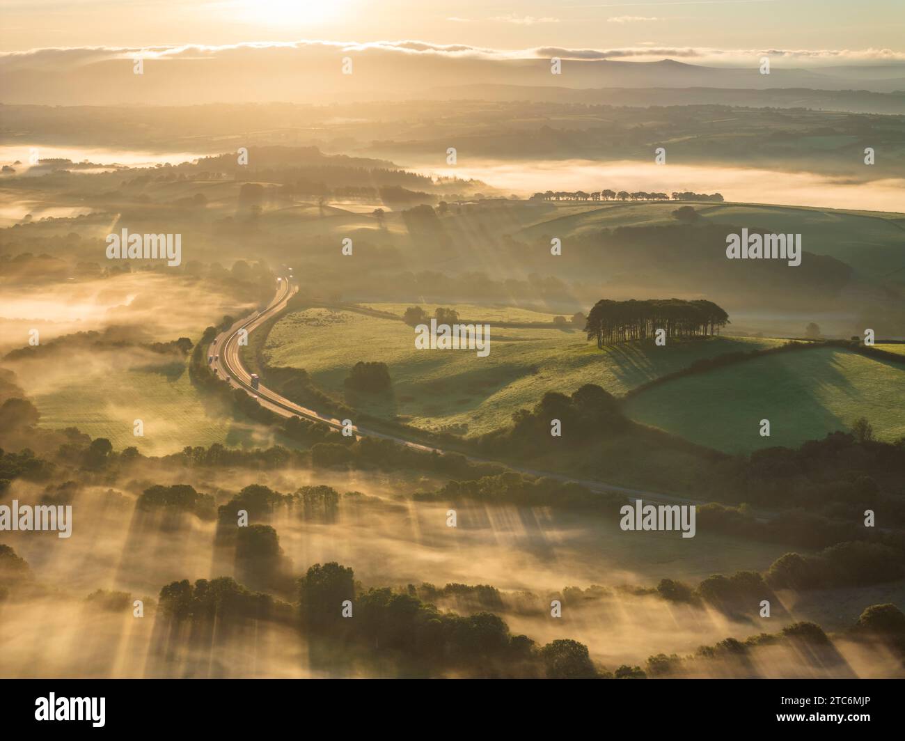 Aerial view of Cookworthy Knapp (Nearly Home Trees) near the A30 on a ...