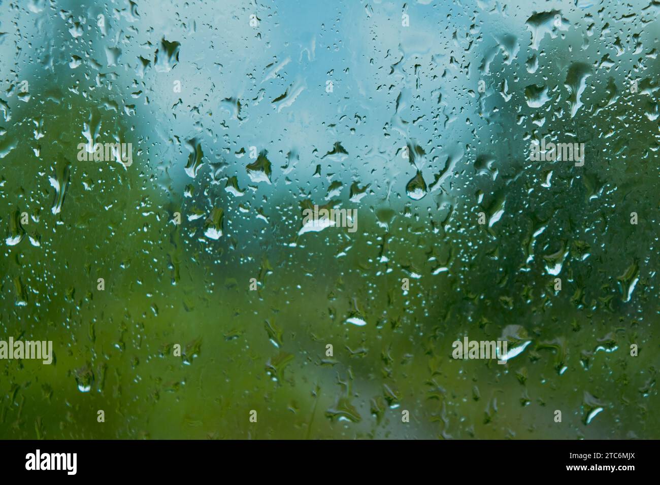Rain drops on the window in rainy day. View from building. Nature ...