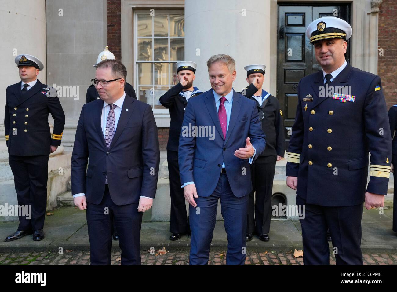 Britain's Defence Secretary Grant Shapps, centre, with Vice Admiral Oleksii Neizhpapa of Ukraine ...