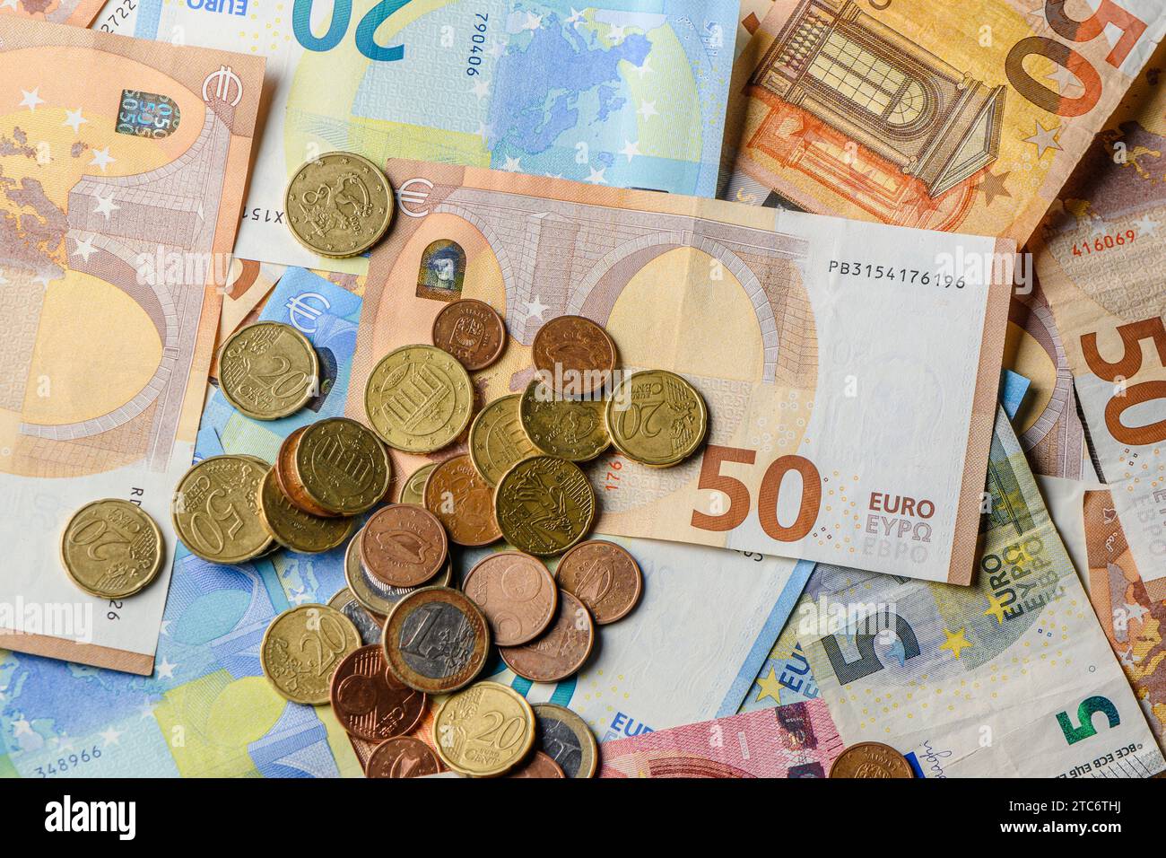 Euro bills and coins scattered on the table as a background 18 Stock ...