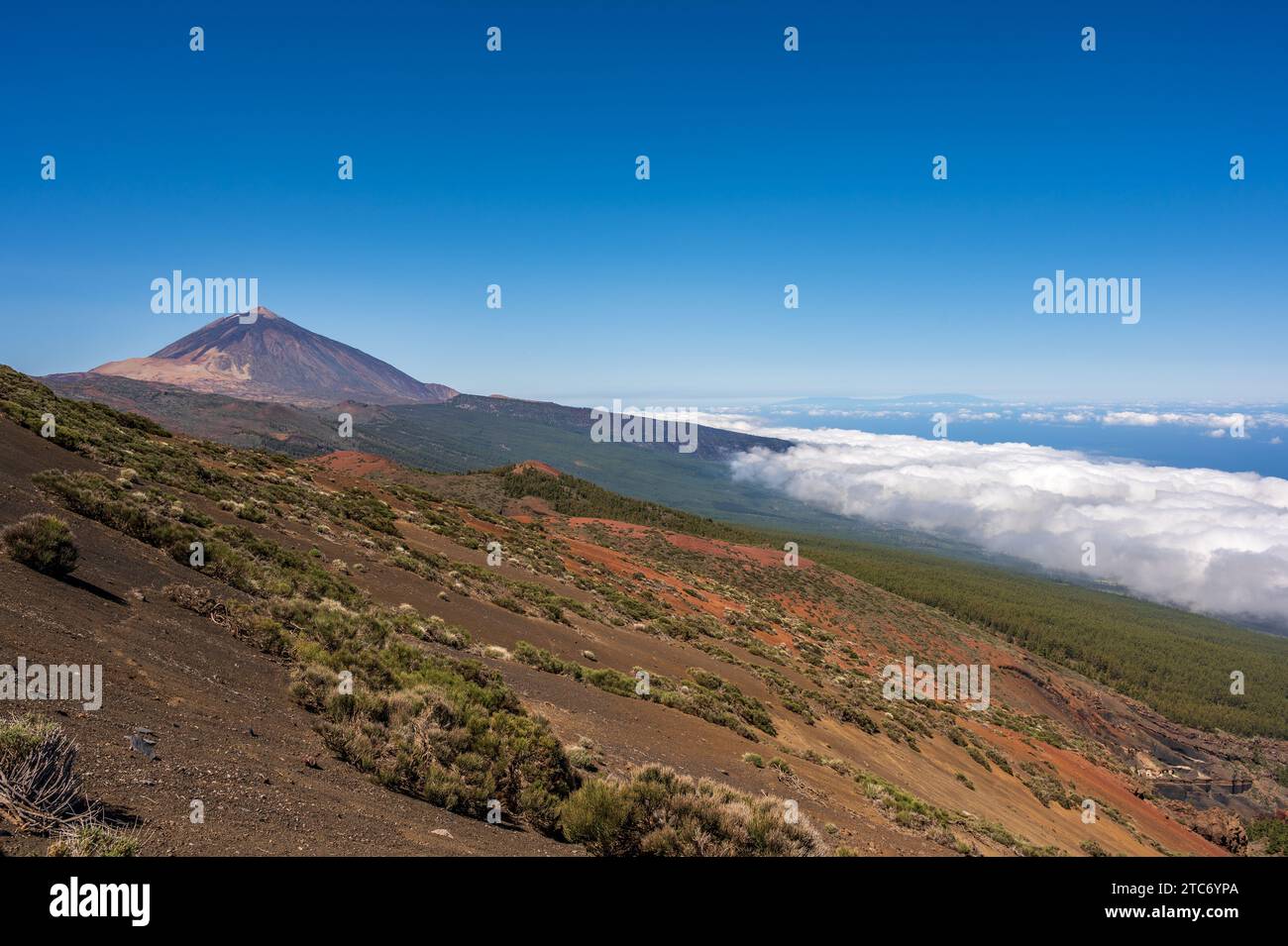 Clouds covering the landscape underneath the peak of Mount Teide ...
