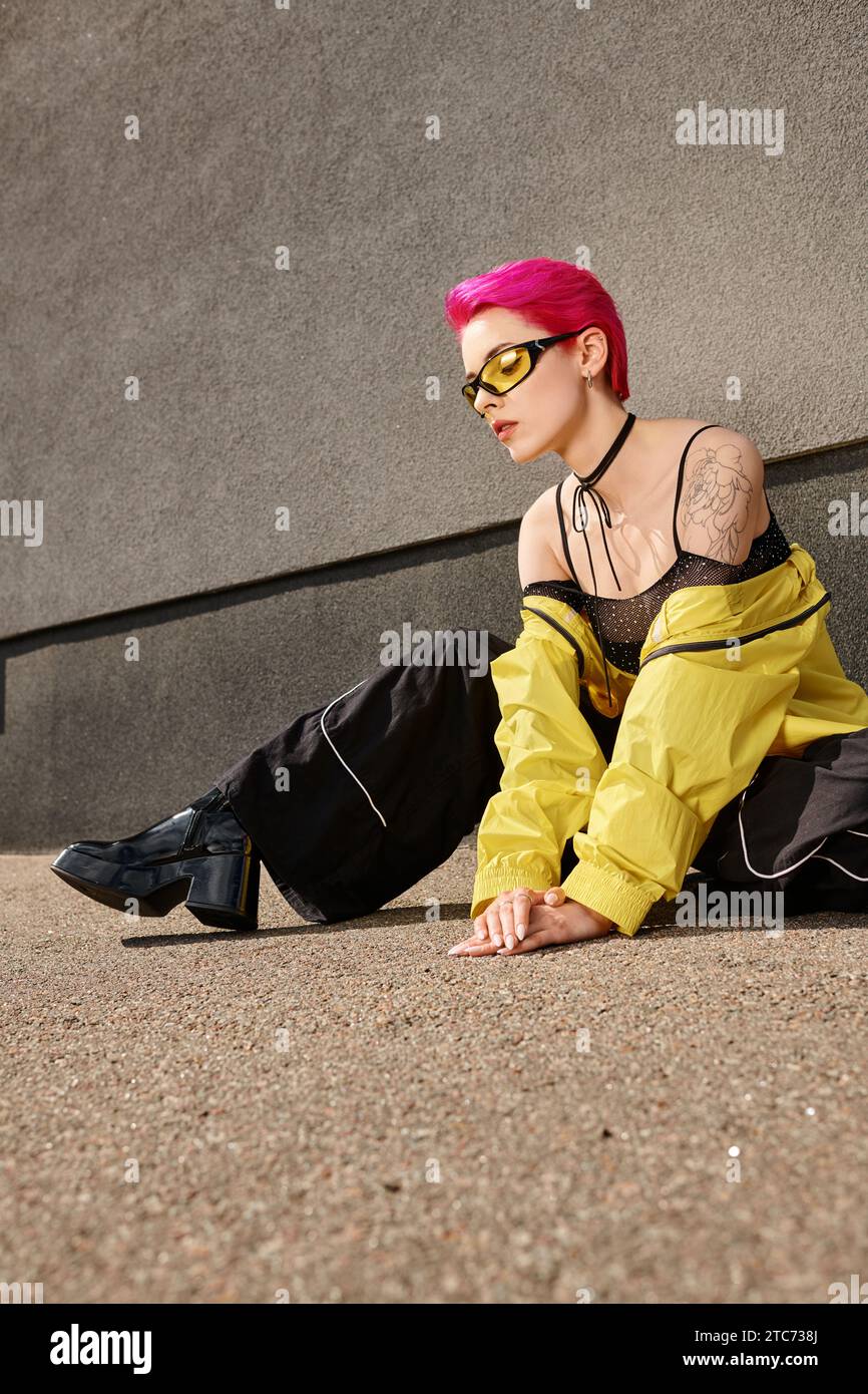 full length, pink haired woman in yellow sunglasses and trendy outfit ...