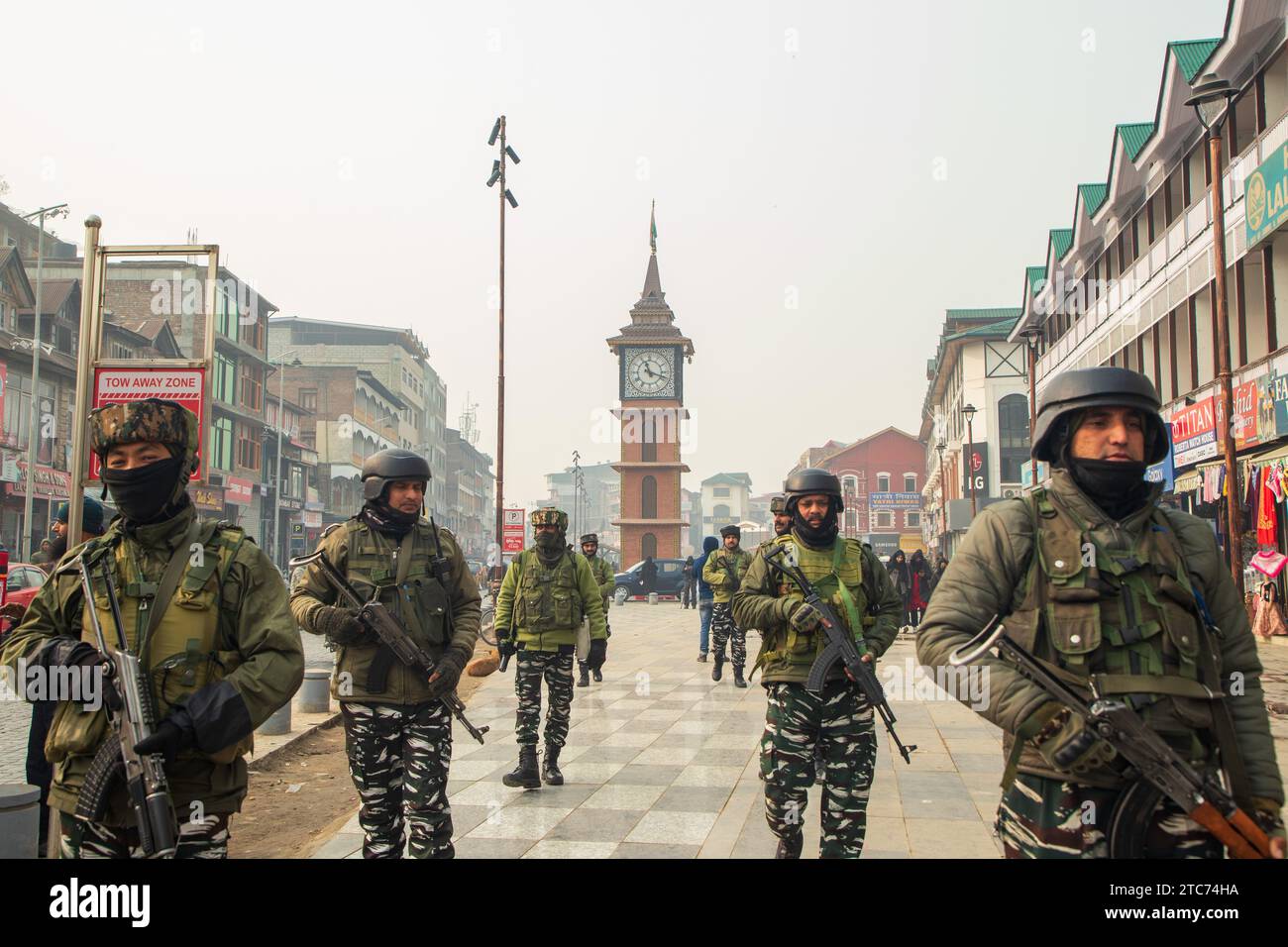Indian paramilitary personnel patrol along a road in Srinagar ahead of ...