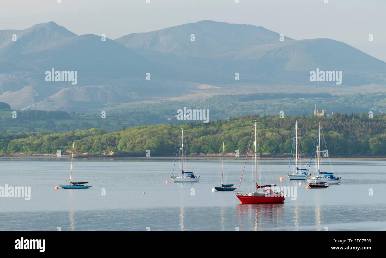 Sailing boats moored on the Menai Strait at Beaumaris, Isle of Anglesey ...