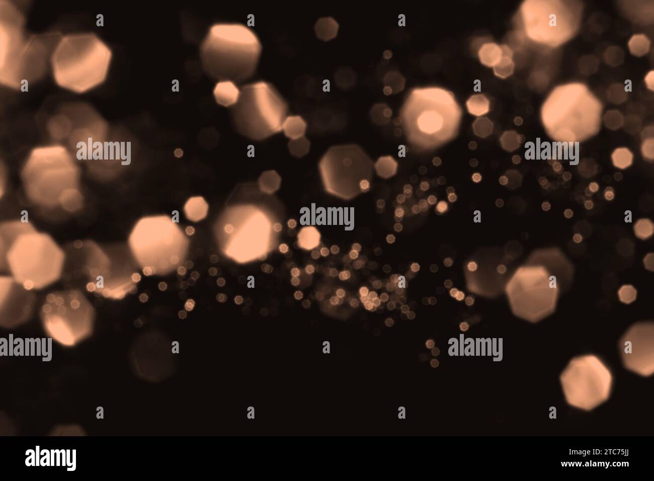 Peach fuzz blurred abstract bokeh lights on black background. Snowy ...