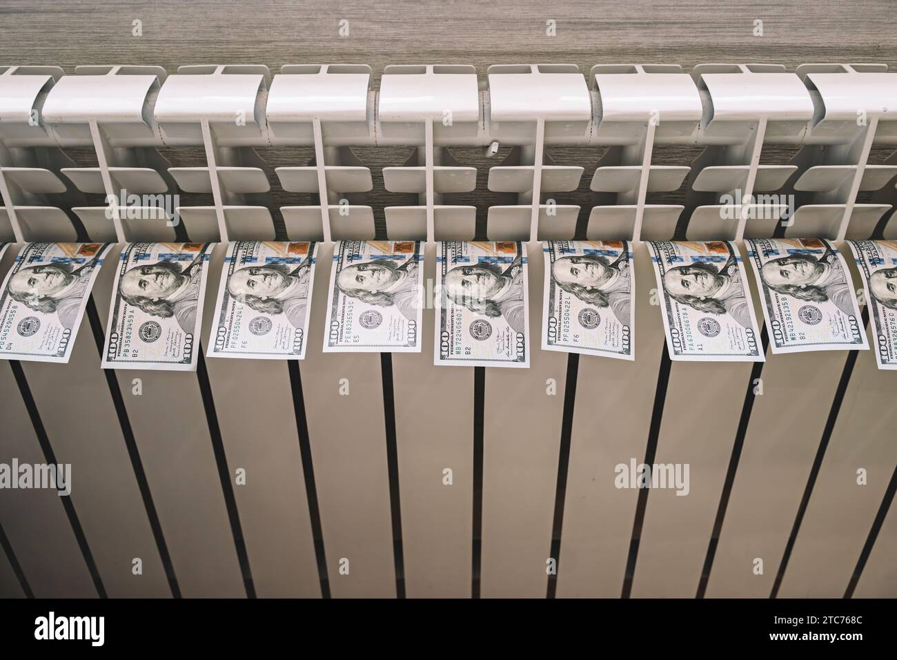 Closeup dollar bills on radiator. concept of paying for heating in ...