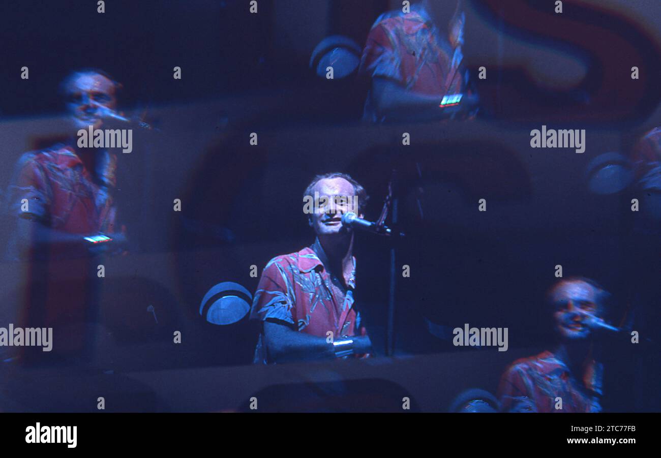 Singer, songwriter and performer Peter Allen on stage in Central Park ...