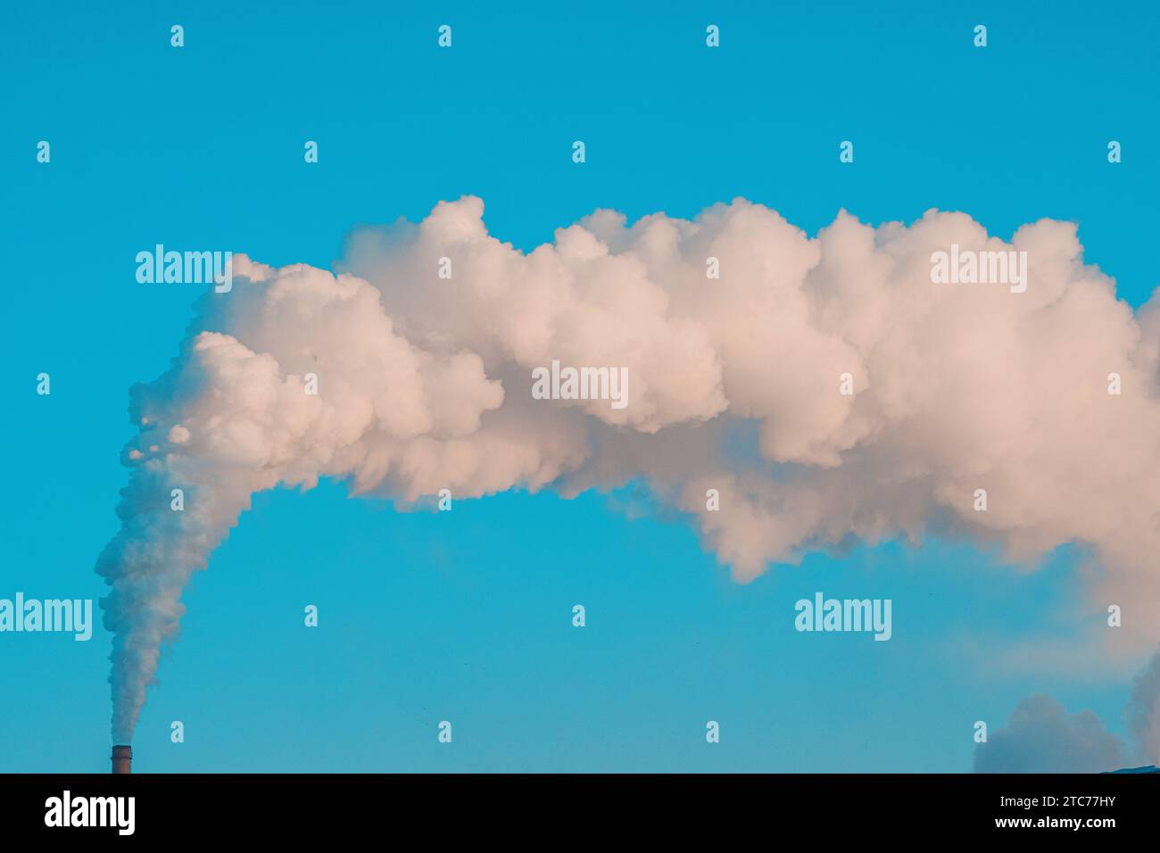 Smoke from chimney against blue sky. Ecological problem. Release of ...