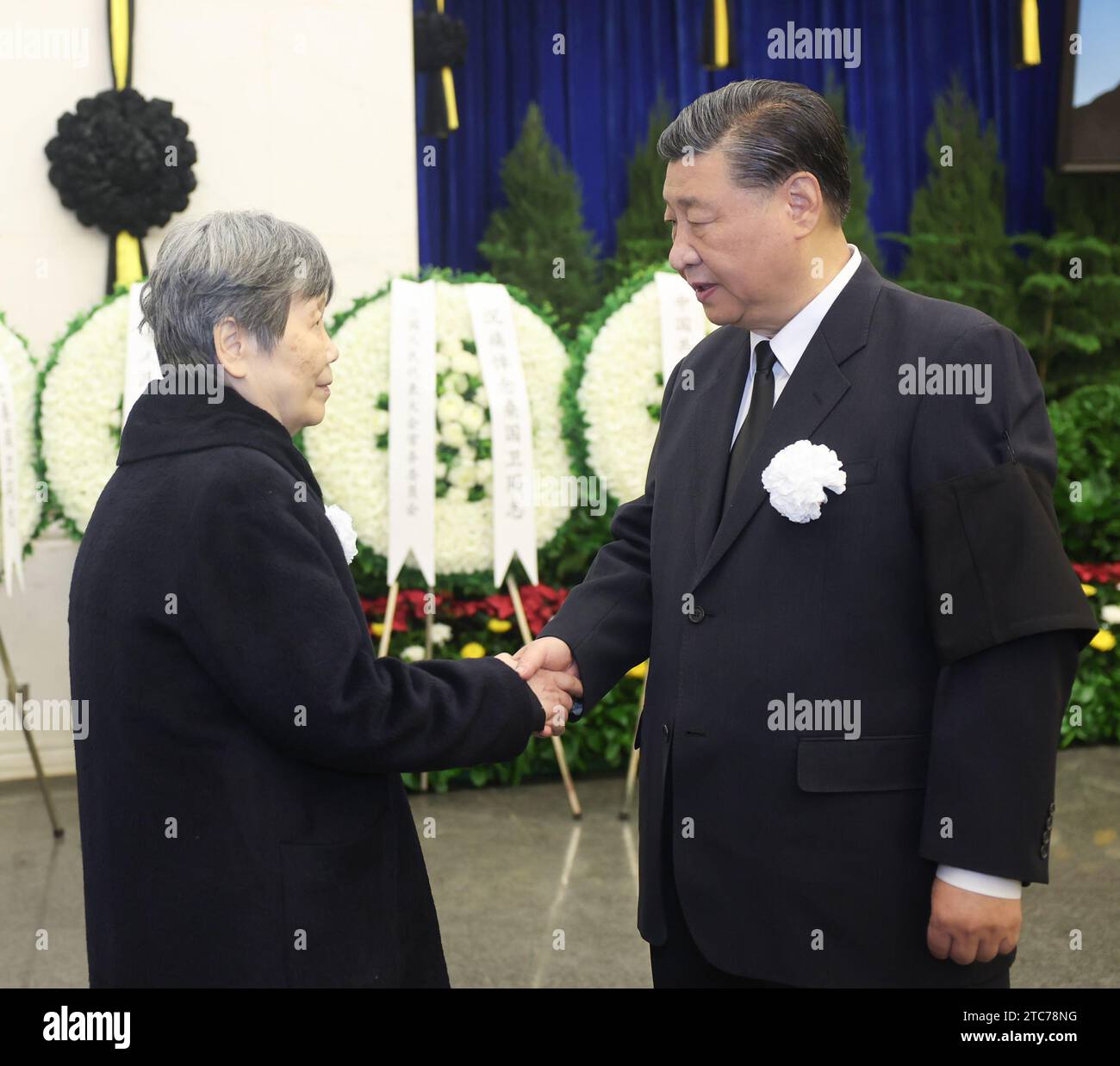 Beijing, China. 11th Dec, 2023. Xi Jinping shakes hands with a family ...