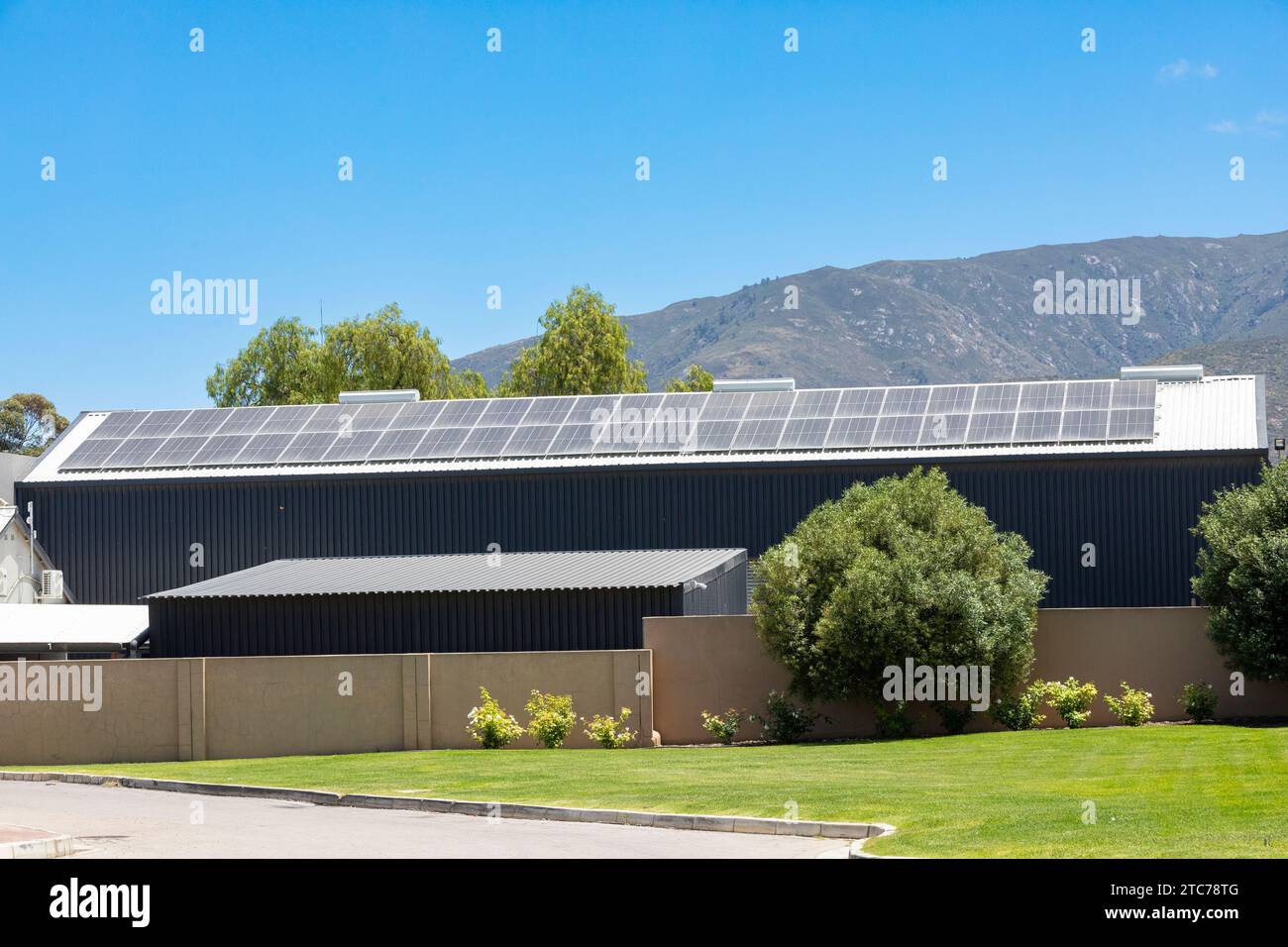 Rooftop photovoltaic solar panels on a commercial building or warehouse ...