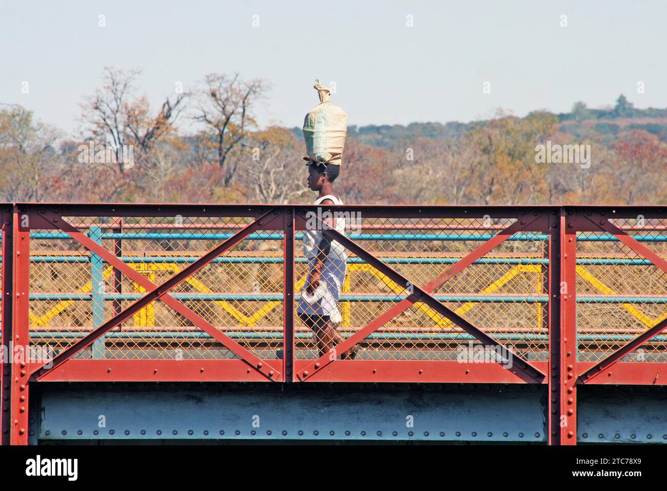 Pedestrian crossing the Victoria Falls Bridge, Victora Falls, Zimbabwe ...