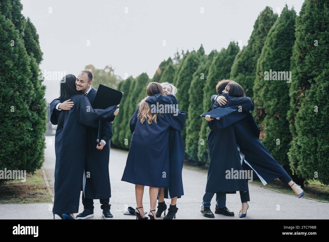 Group of University Students Celebrating Graduation in the Park Stock ...