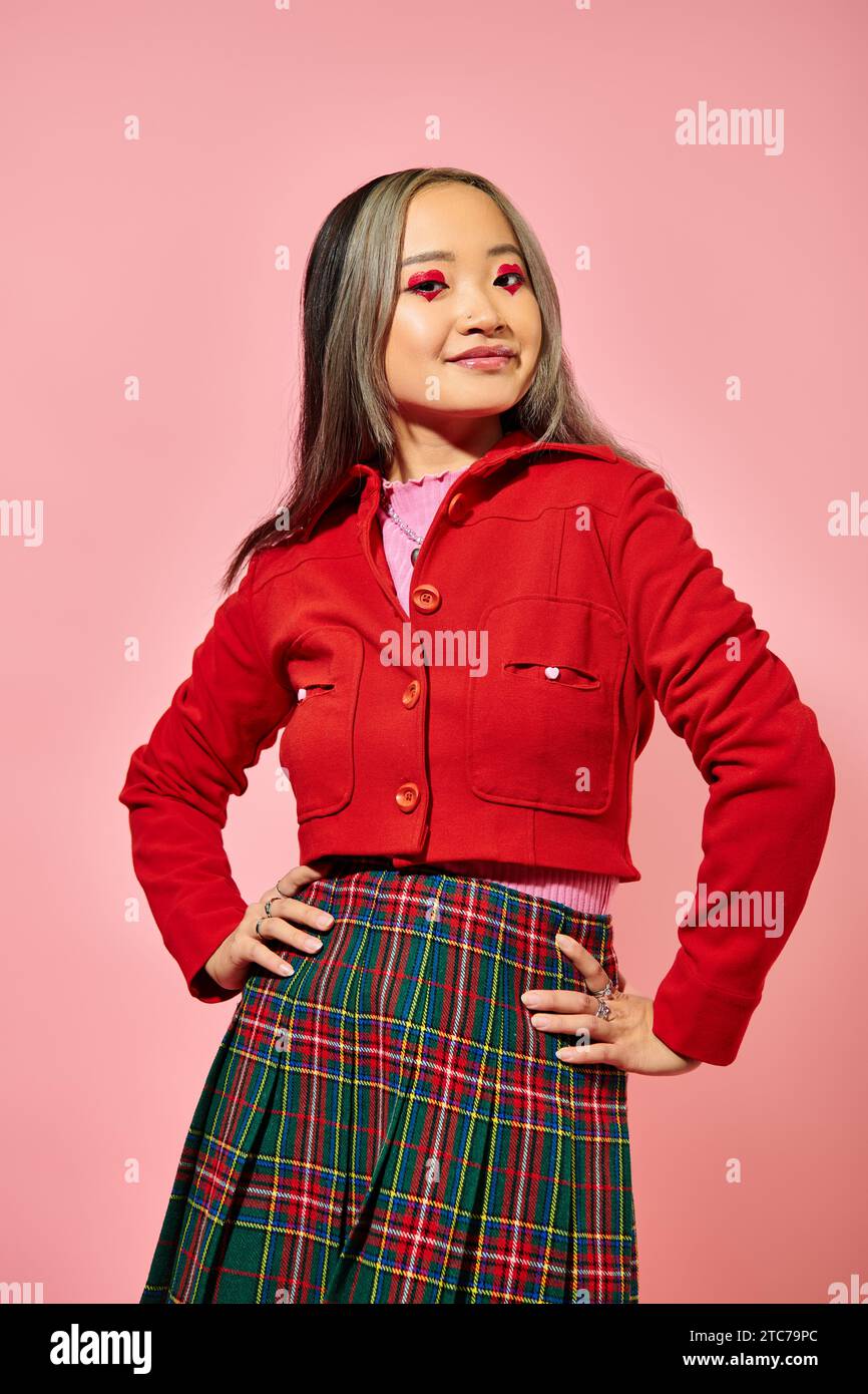 Valentines day concept, happy asian girl in red jacket posing with ...