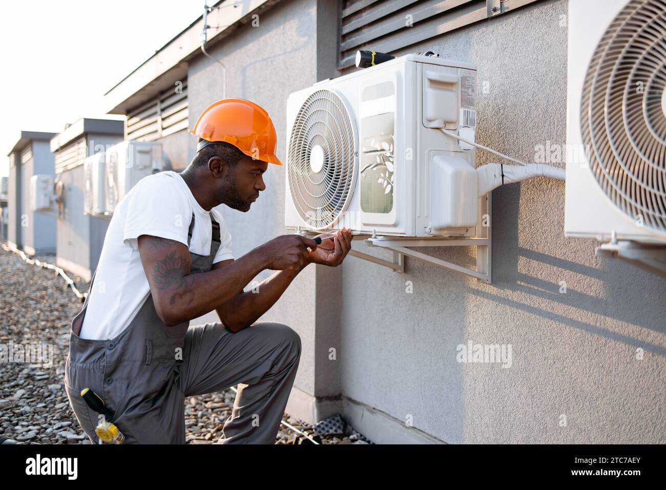 Man repairing device cooling hi-res stock photography and images - Alamy