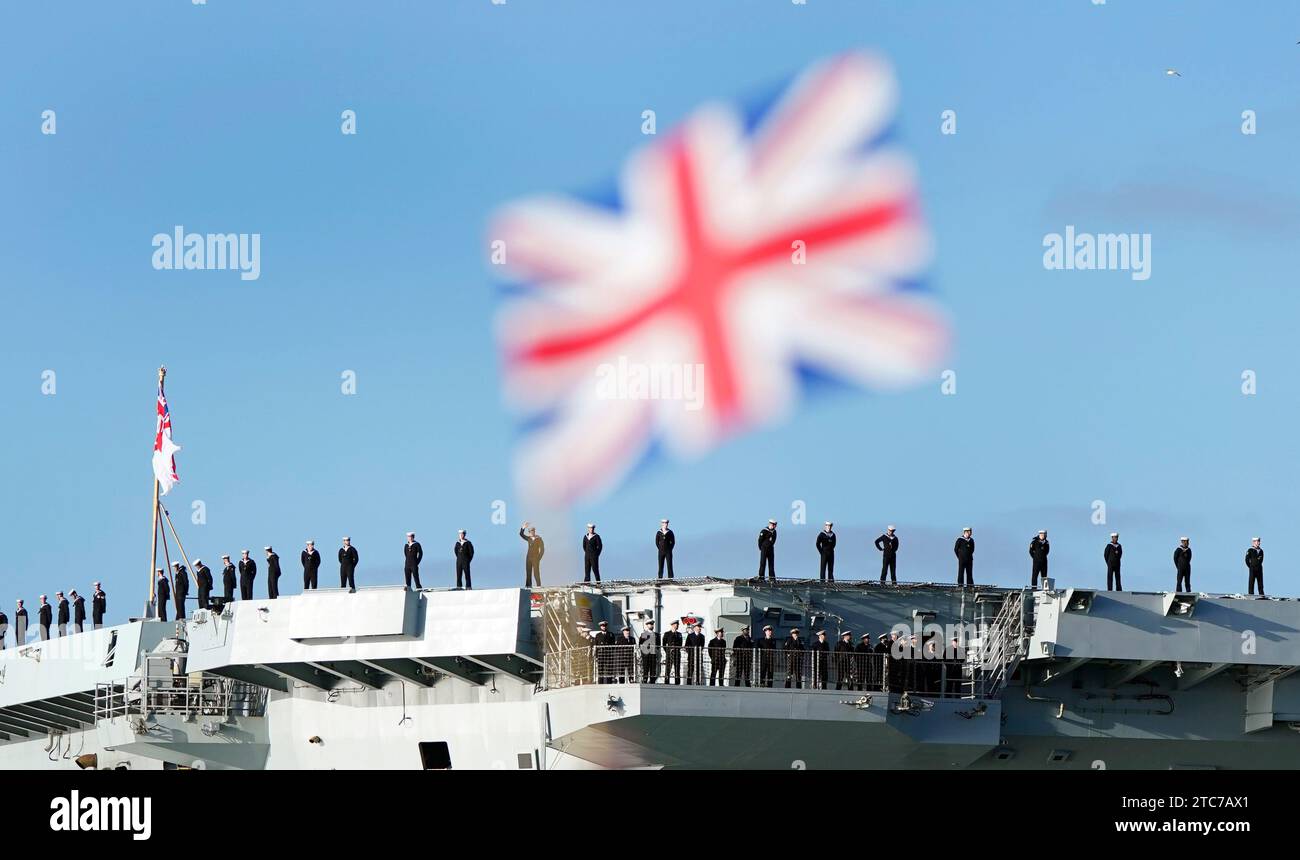 Sailors line the flight deck of the Royal Navy aircraft carrier HMS ...