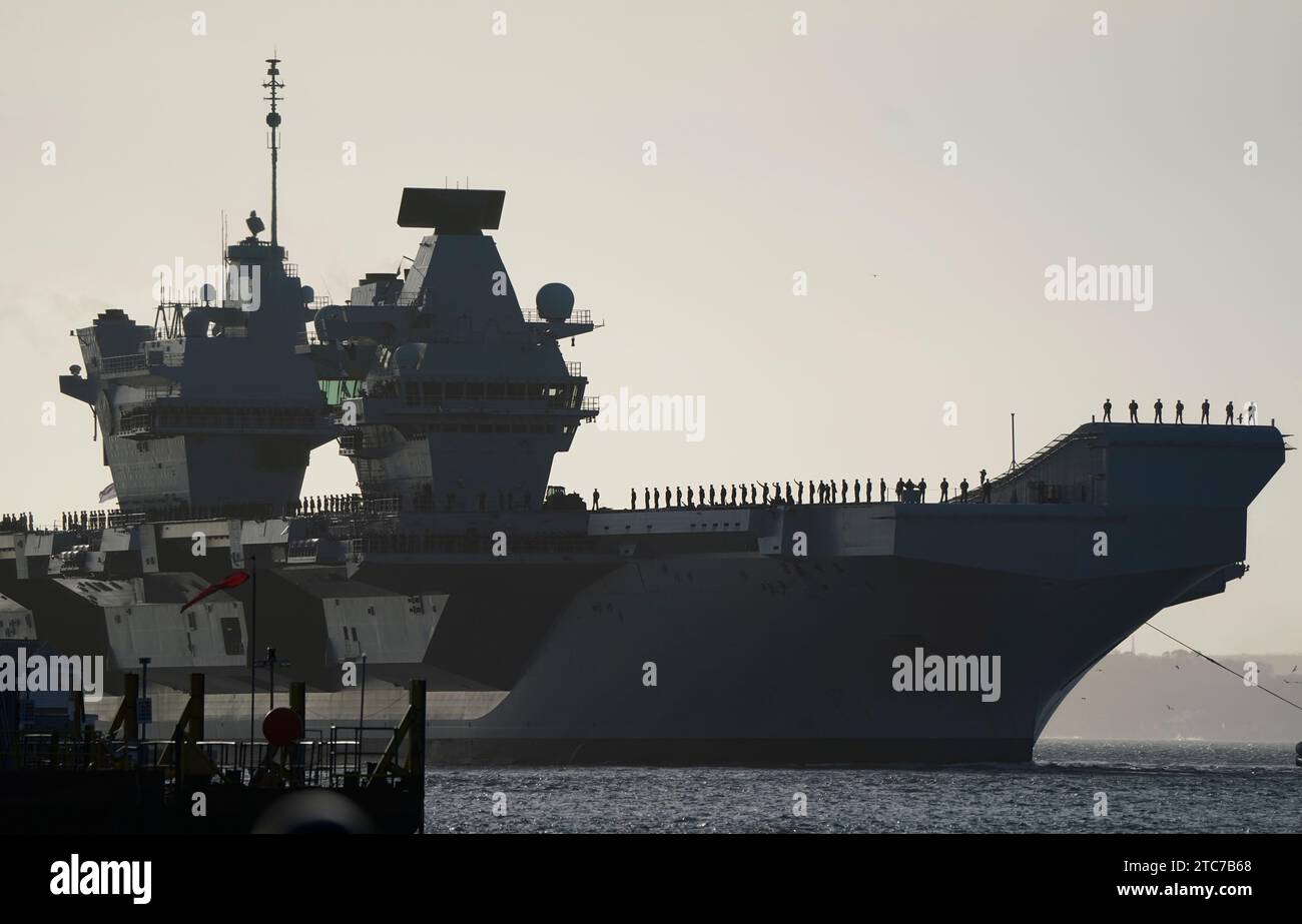 Sailors line the flight deck of the Royal Navy aircraft carrier HMS ...