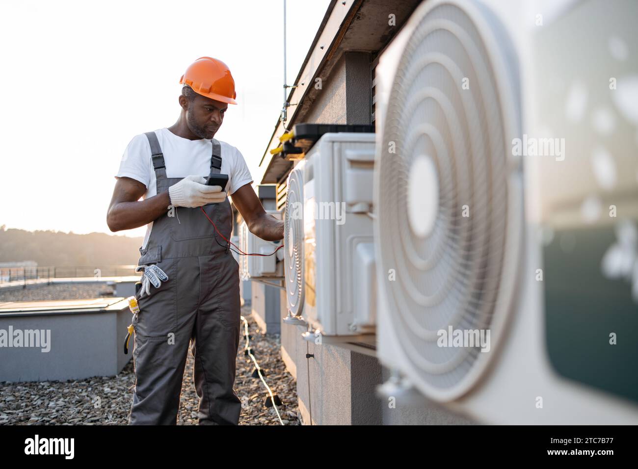 Man using tester for measuring strength in air conditioner Stock Photo ...
