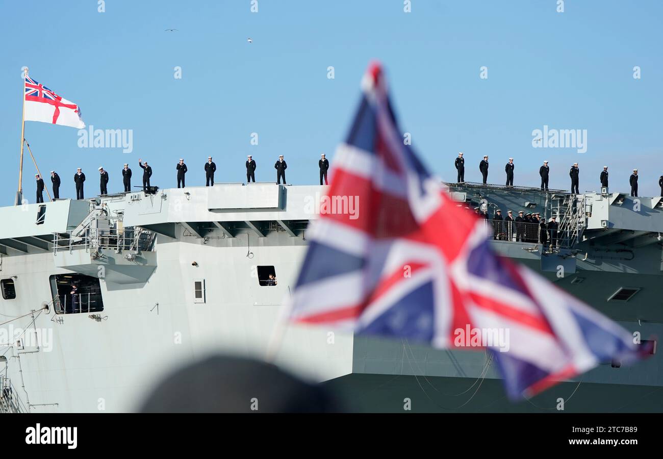 Sailors line the flight deck of the Royal Navy aircraft carrier HMS ...