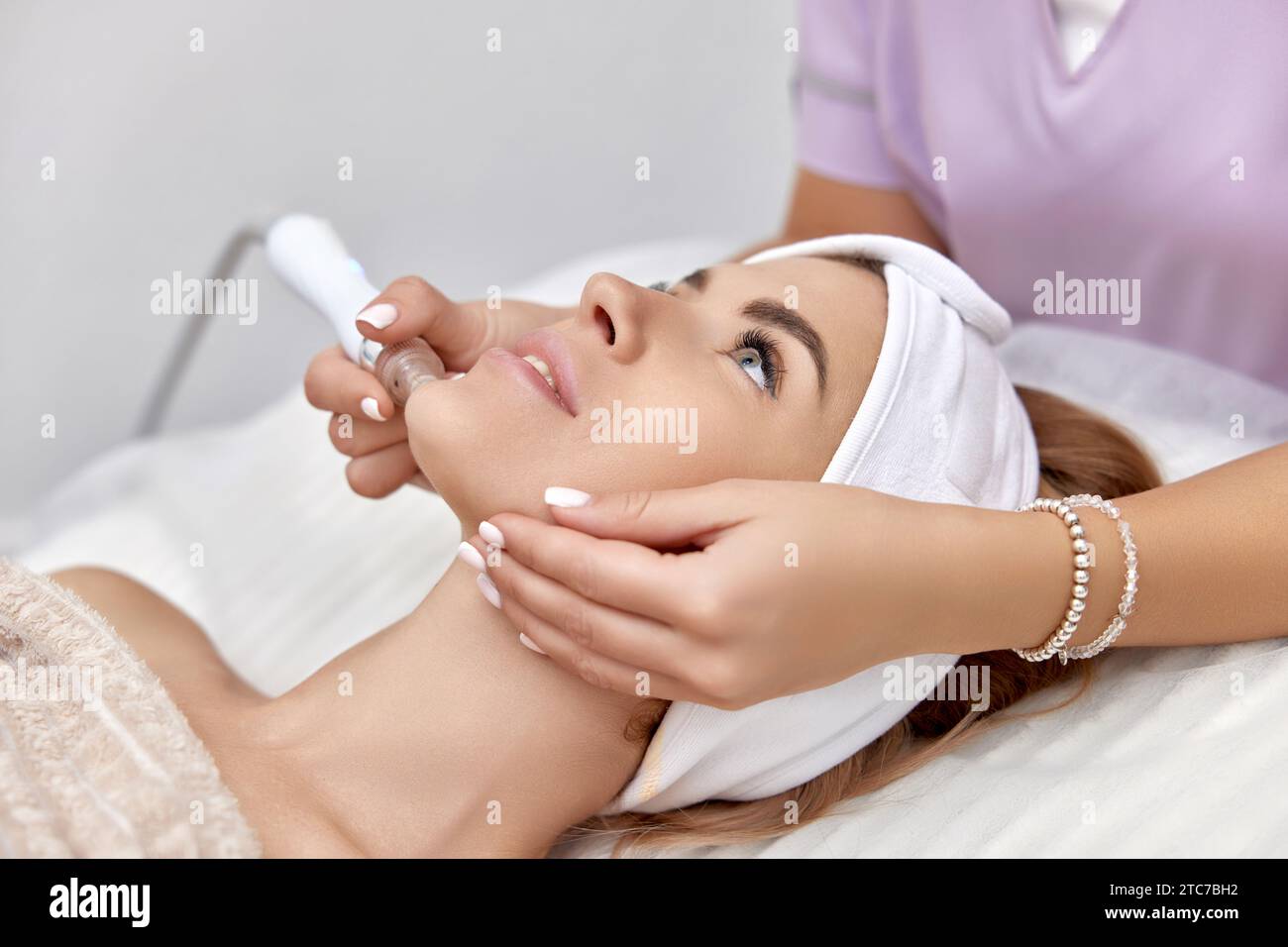 beautiful woman getting microdermabrasion procedure in a beauty spa ...
