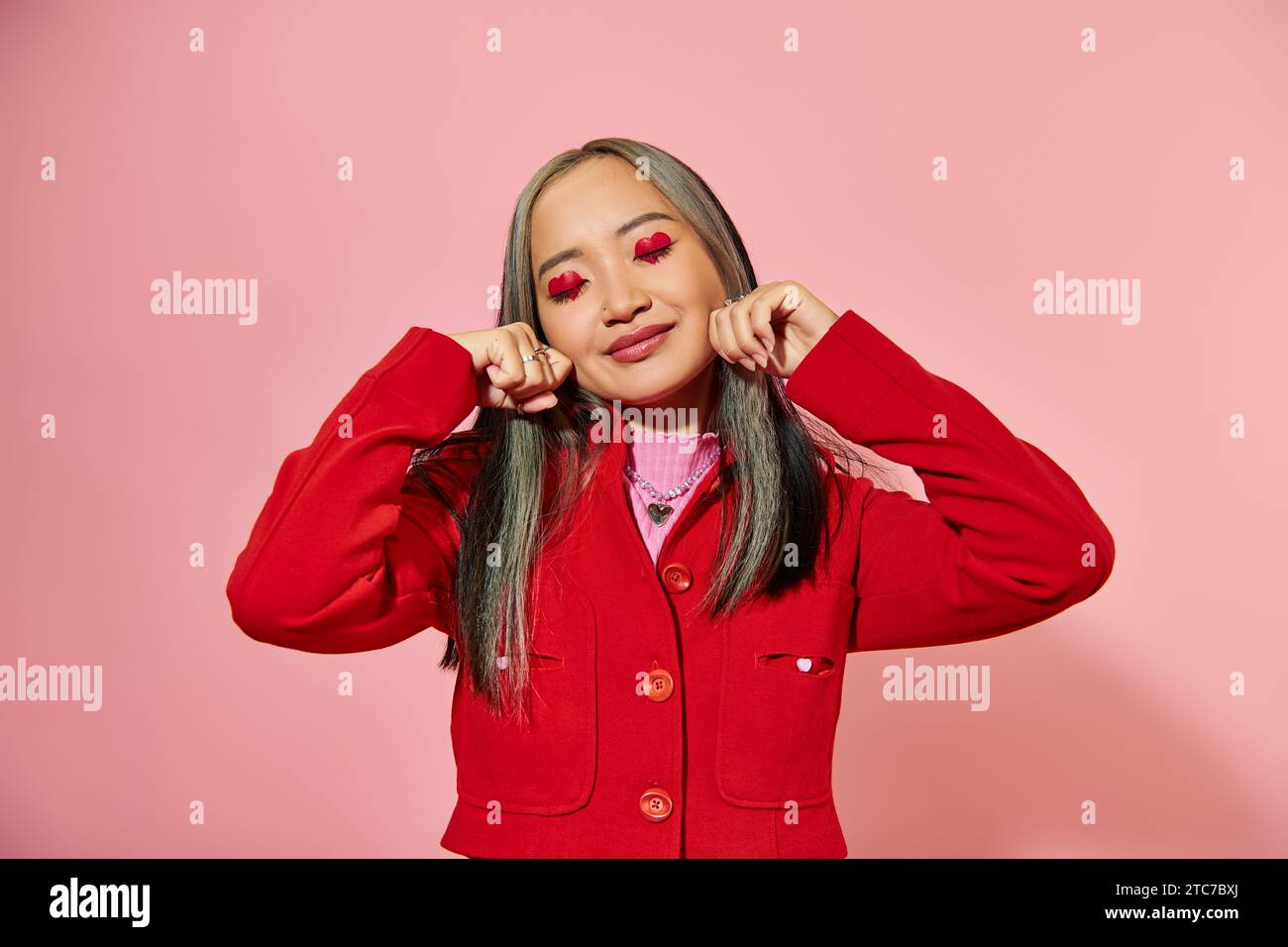 portrait of asian young girl with heart shape eye makeup showing crying ...