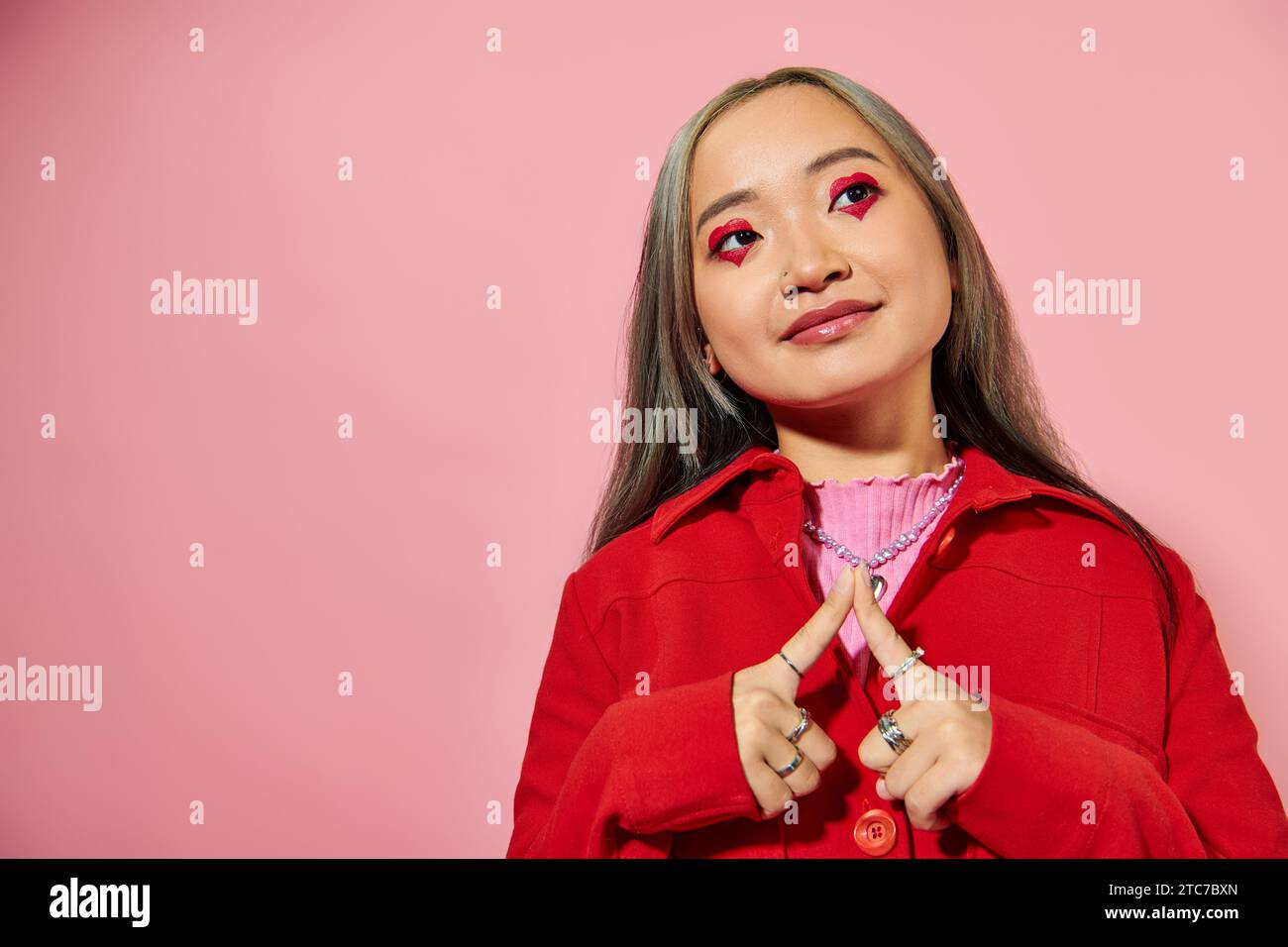 Pleased Young Asian Woman With Heart Shaped Eye Makeup Smiling And
