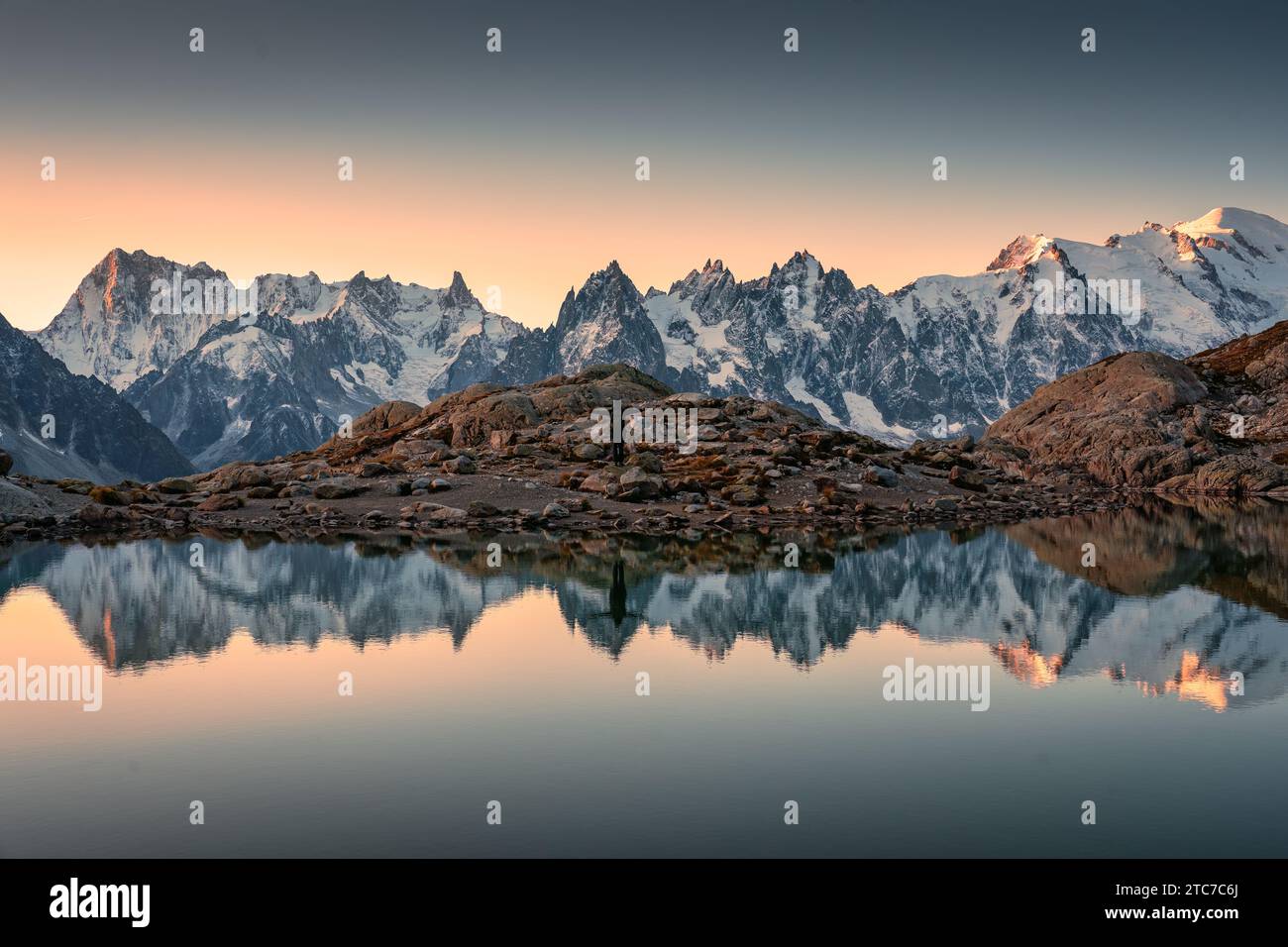 Majestic landscape of Lac Blanc with Mont Blanc mountain range and male ...
