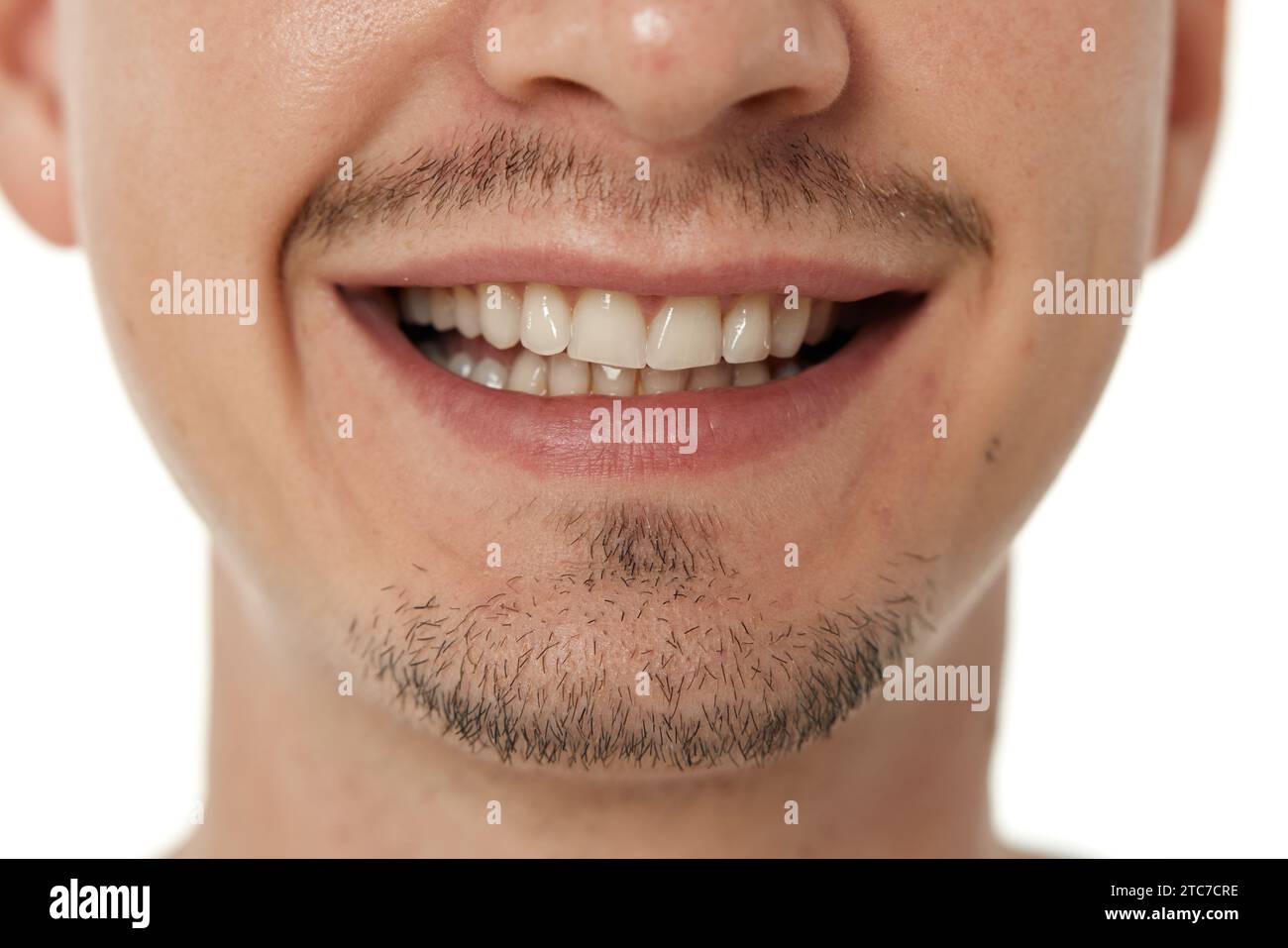 mouth and teeth of smiling man on studio background. male face with ...