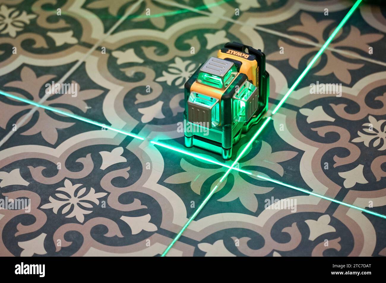 Laser level measuring tool in construction site for laying tiles Stock ...