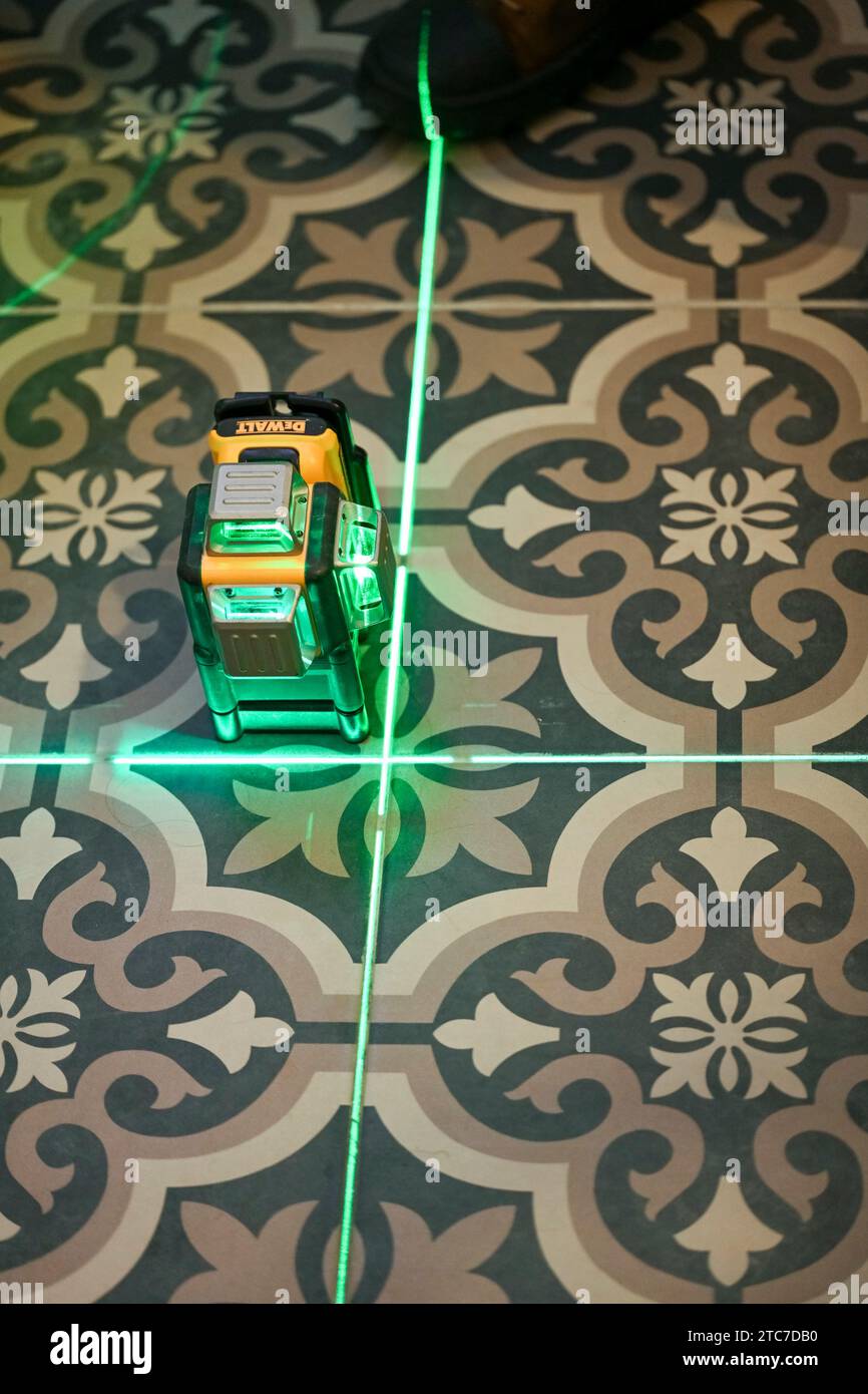 Laser level measuring tool in construction site for laying tiles Stock ...