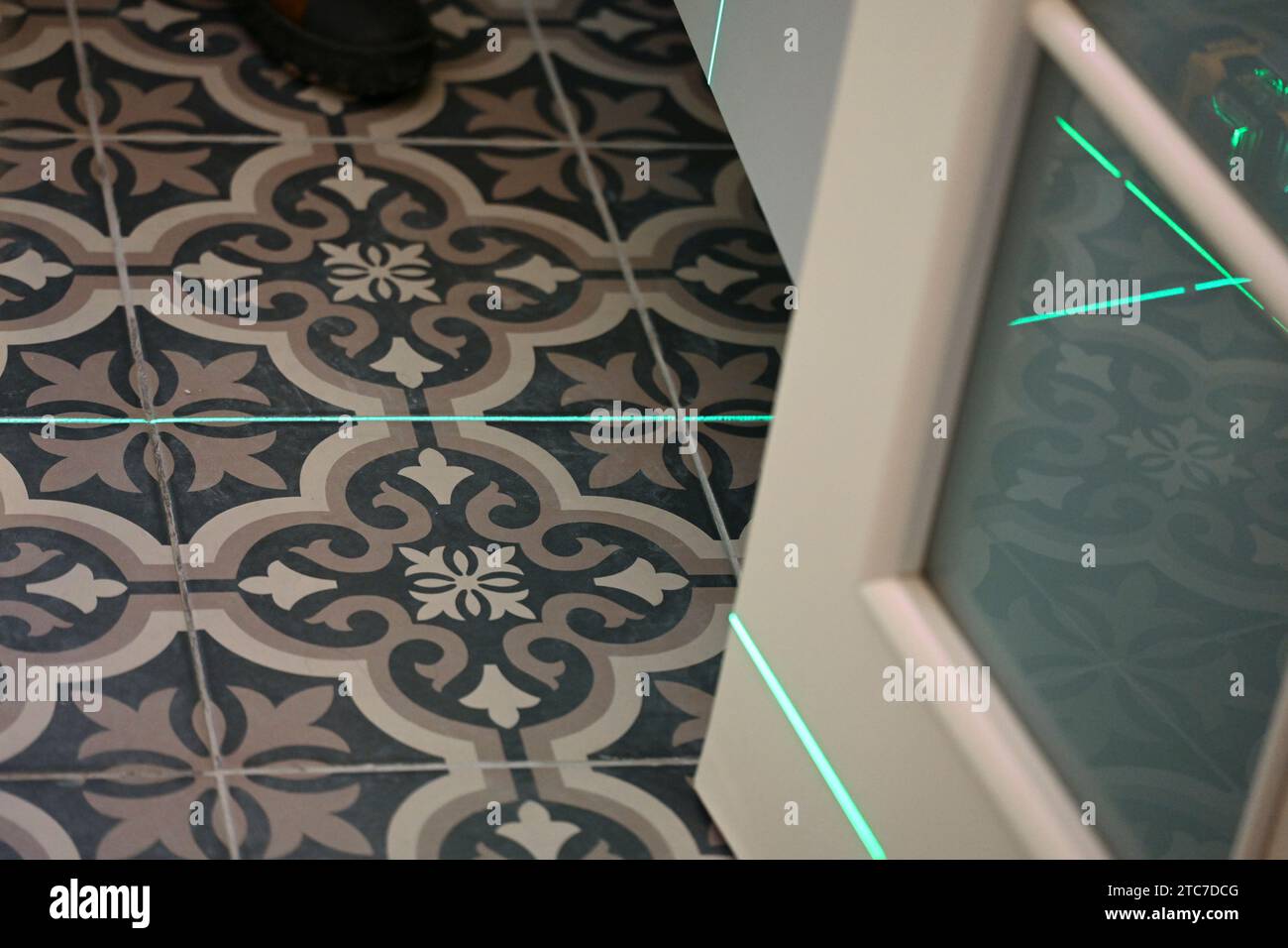 Laser level measuring tool in construction site for laying tiles Stock ...