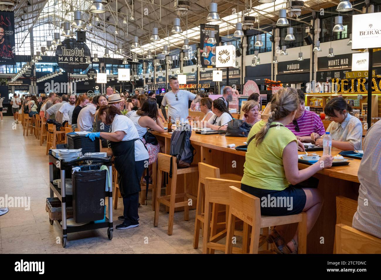 People at the Time Out Market Lisboa, a food hall and major touristic ...