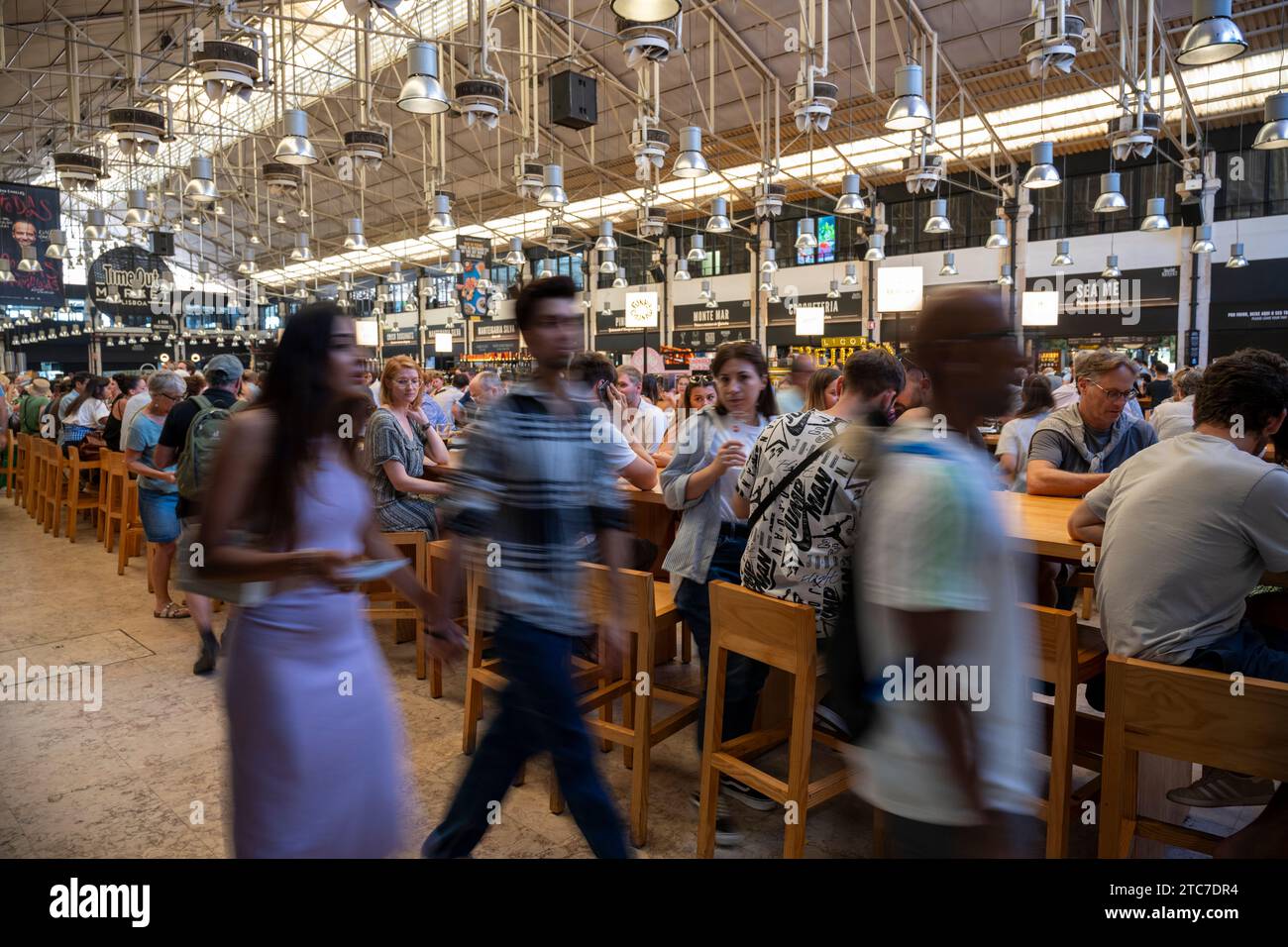 People at the Time Out Market Lisboa, a food hall and major touristic ...
