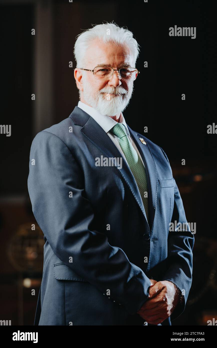 Experienced university rector poses in a prestigious academic classroom ...