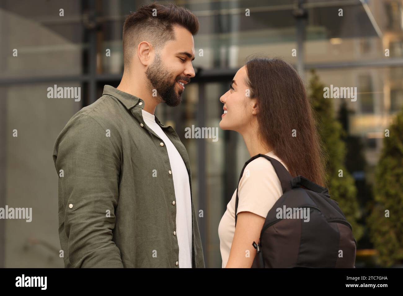 Long-distance relationship. Beautiful young couple with backpack ...