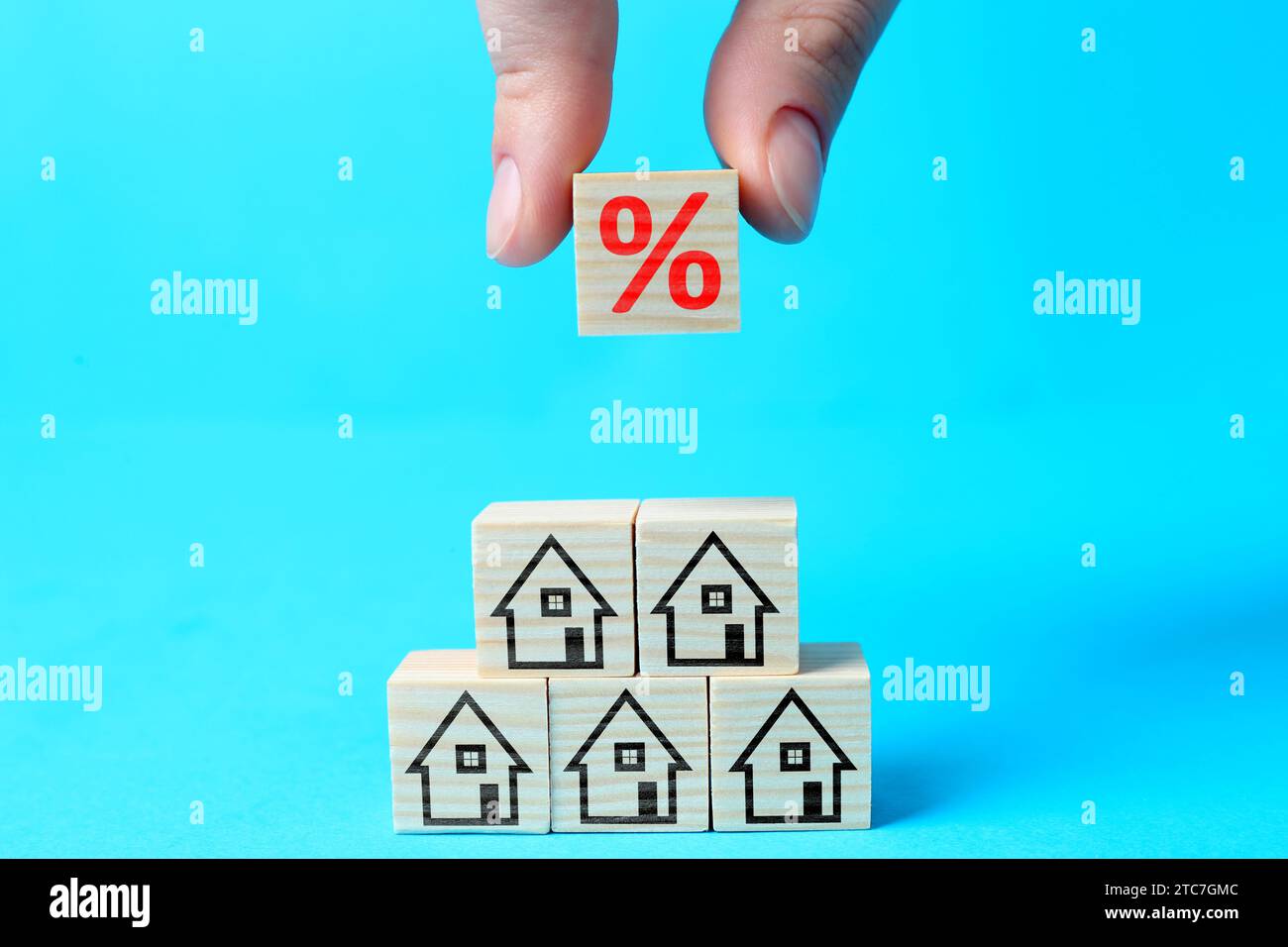Mortgage rate. Woman building pyramid of cubes with percent sign and ...