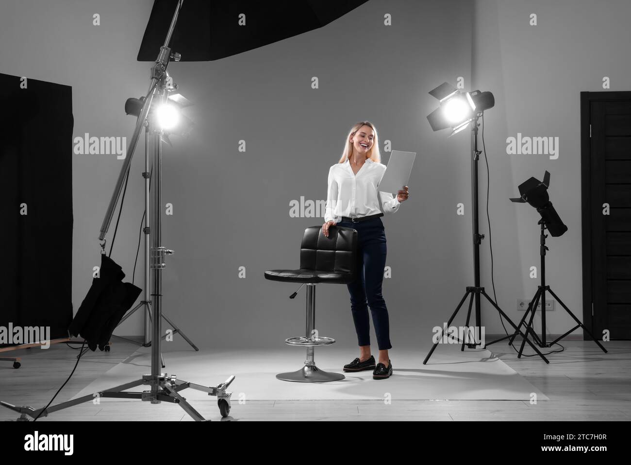 Casting call. Emotional woman performing against grey background in ...