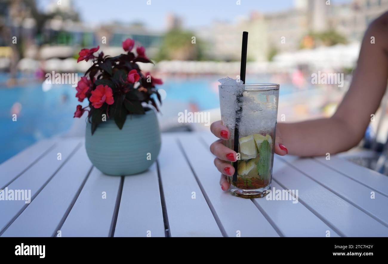Hand holding refreshing mojito hi-res stock photography and images - Alamy