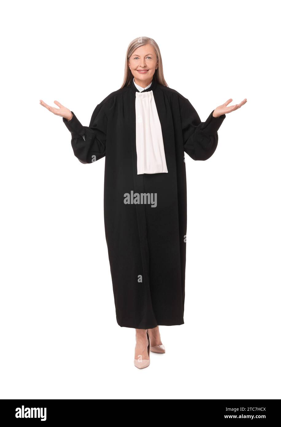 Smiling senior judge in court dress on white background Stock Photo - Alamy