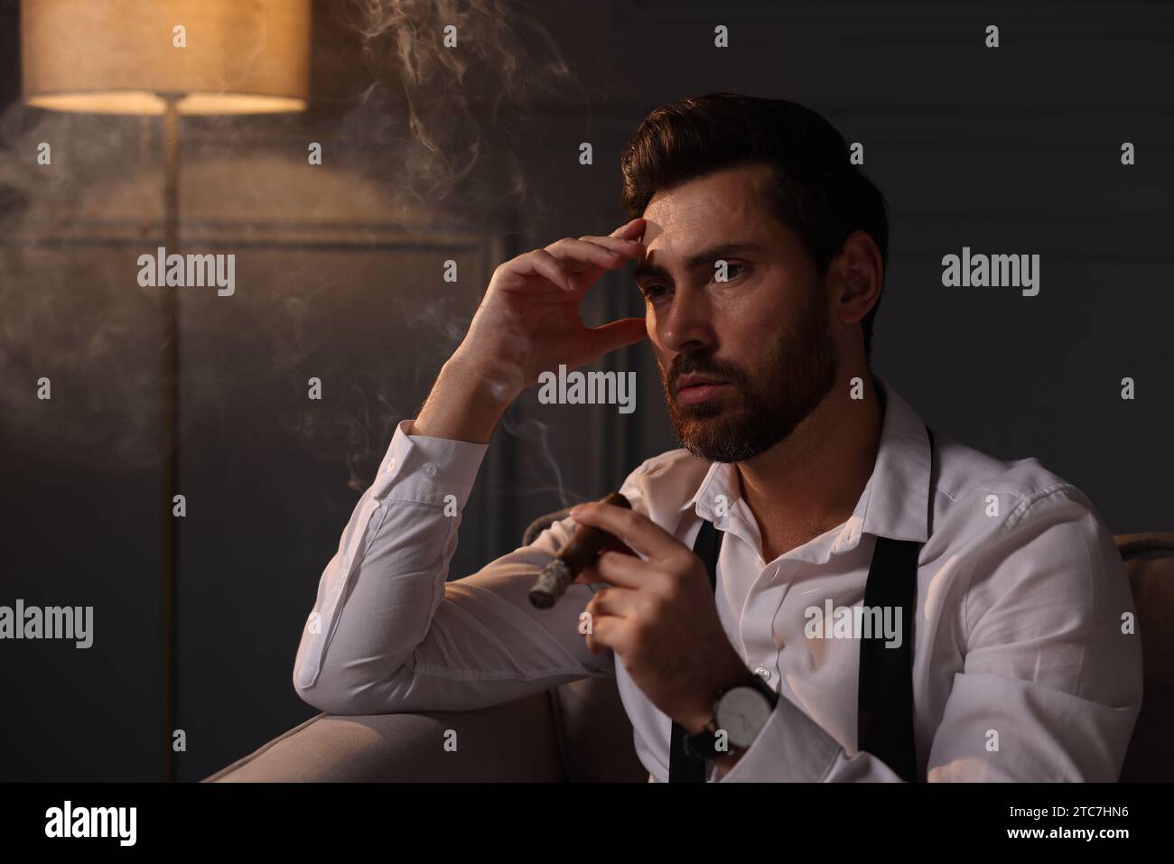 Man in dark room smoking hi-res stock photography and images - Alamy