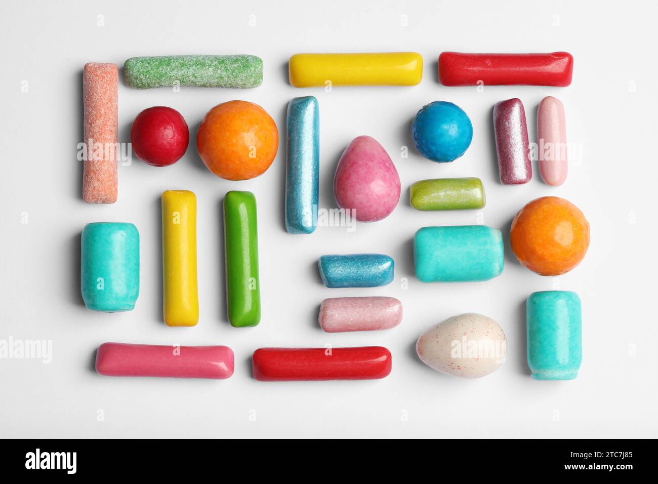 Many tasty bubble gums on white background, flat lay Stock Photo - Alamy
