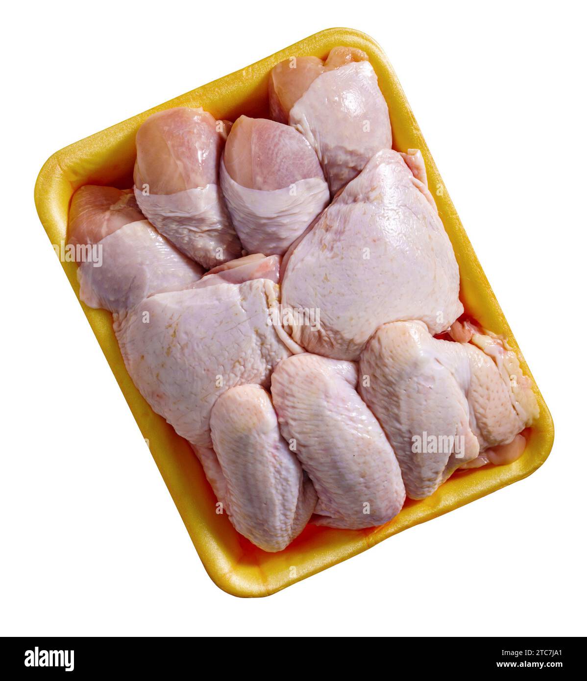 Raw chicken legs, thighs and wings in a plastic tray isolated Stock ...