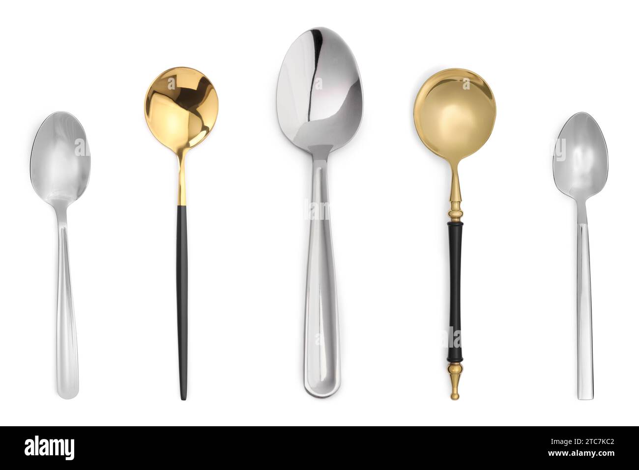 Stylish golden and silver spoons on white background Stock Photo - Alamy