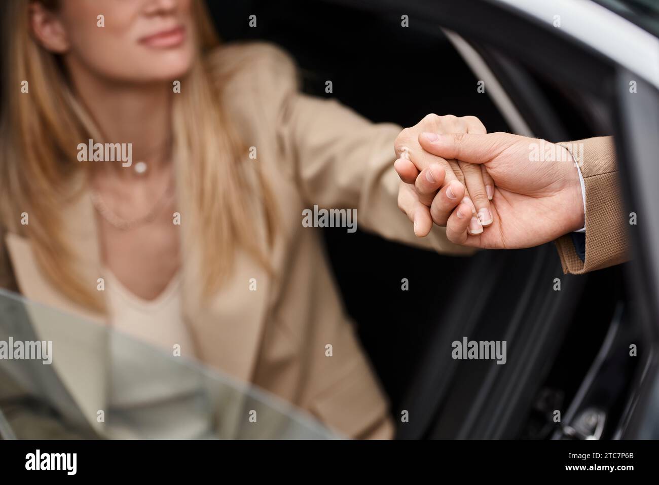 Man helping woman out of car hi-res stock photography and images - Alamy