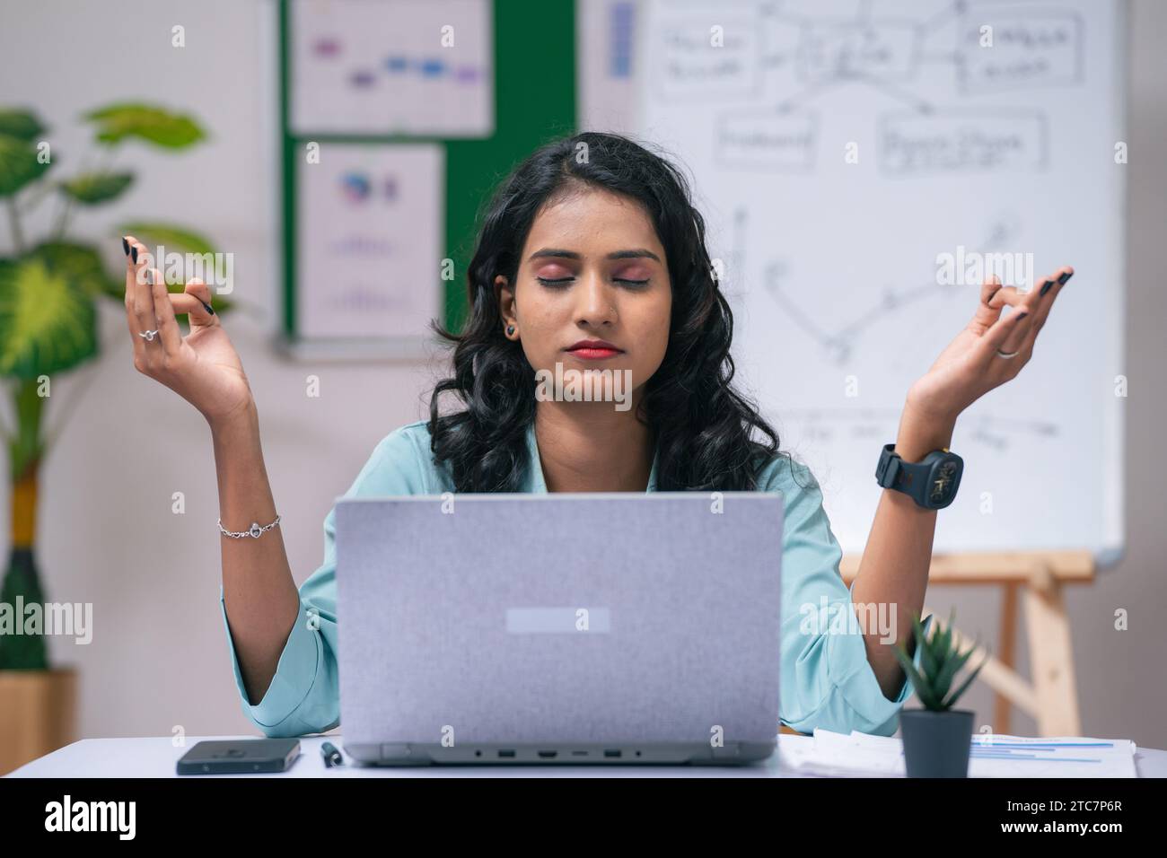 Frustrated businesswoman or employee at office doing meditation at ...